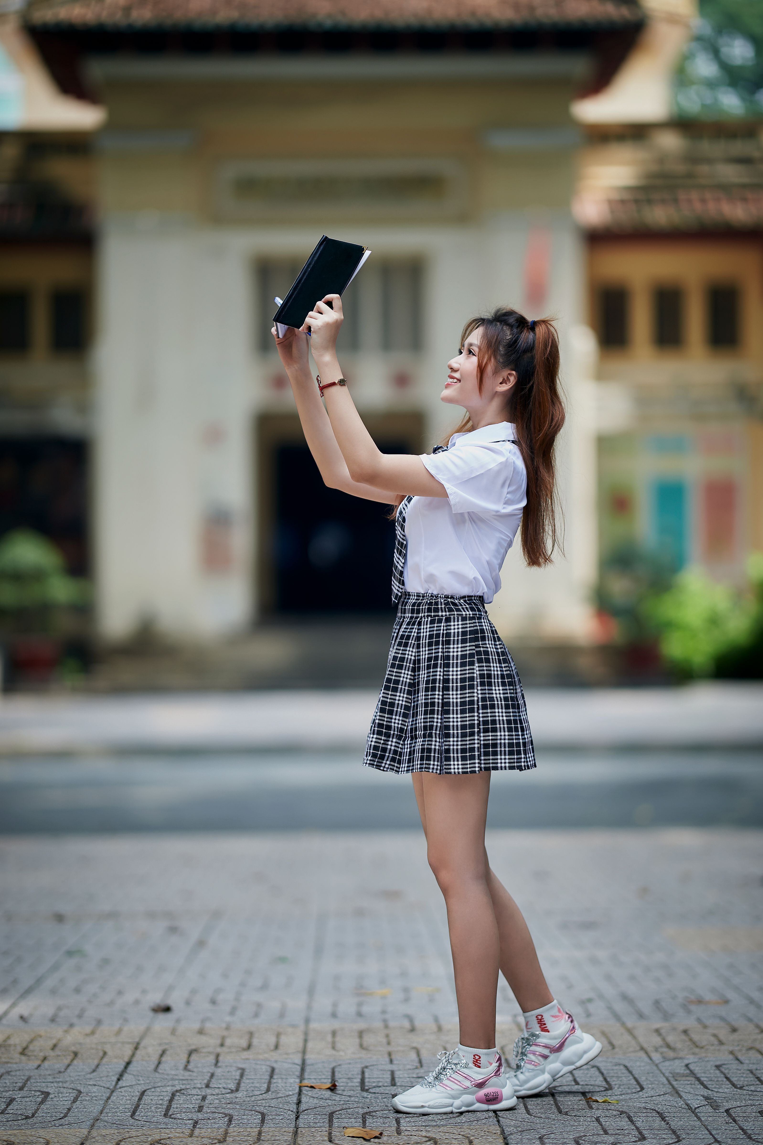A Girl Holding a Book · Free Stock Photo