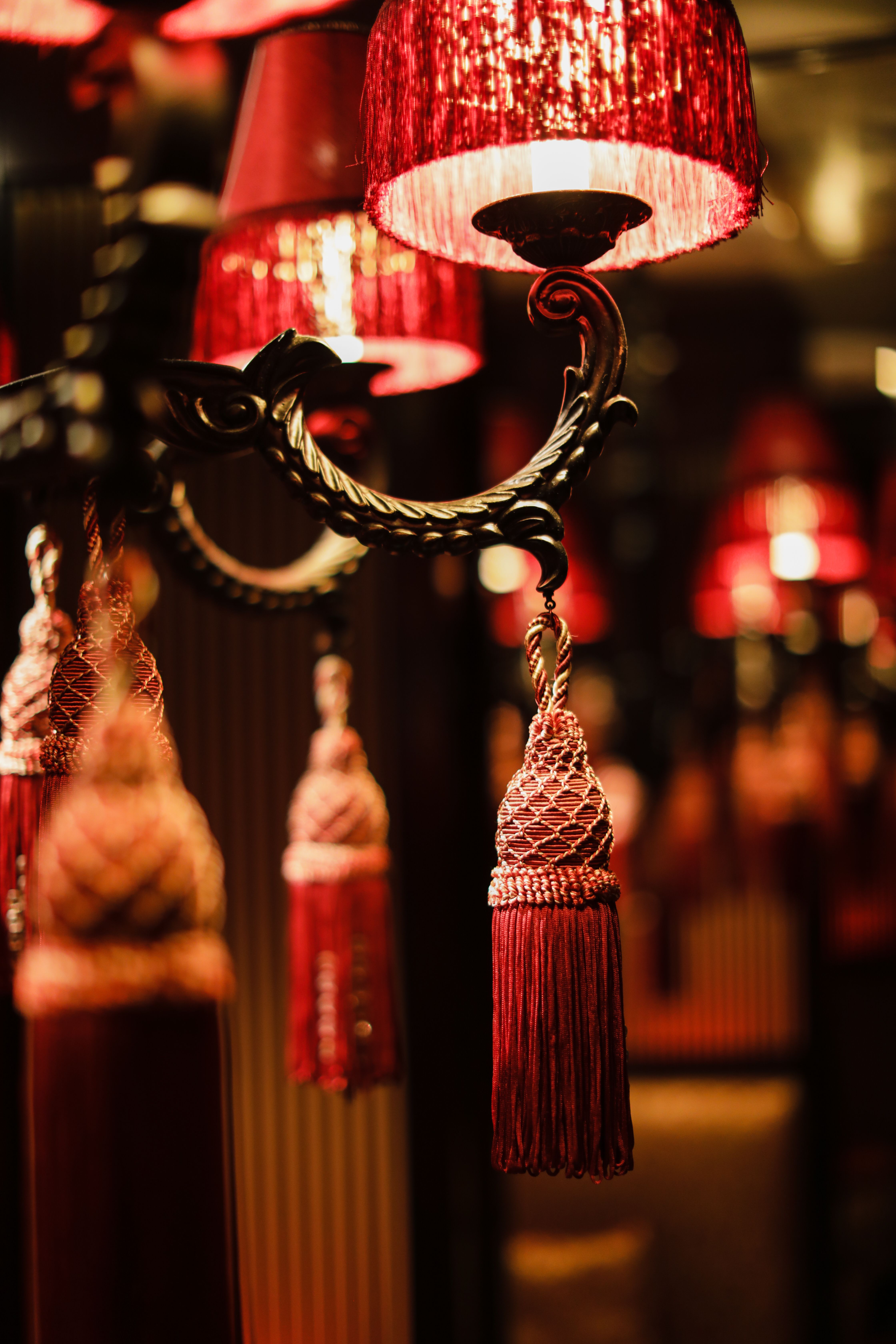 Close Up Photo of Red Pendant Lamps with Tassel · Free Stock Photo