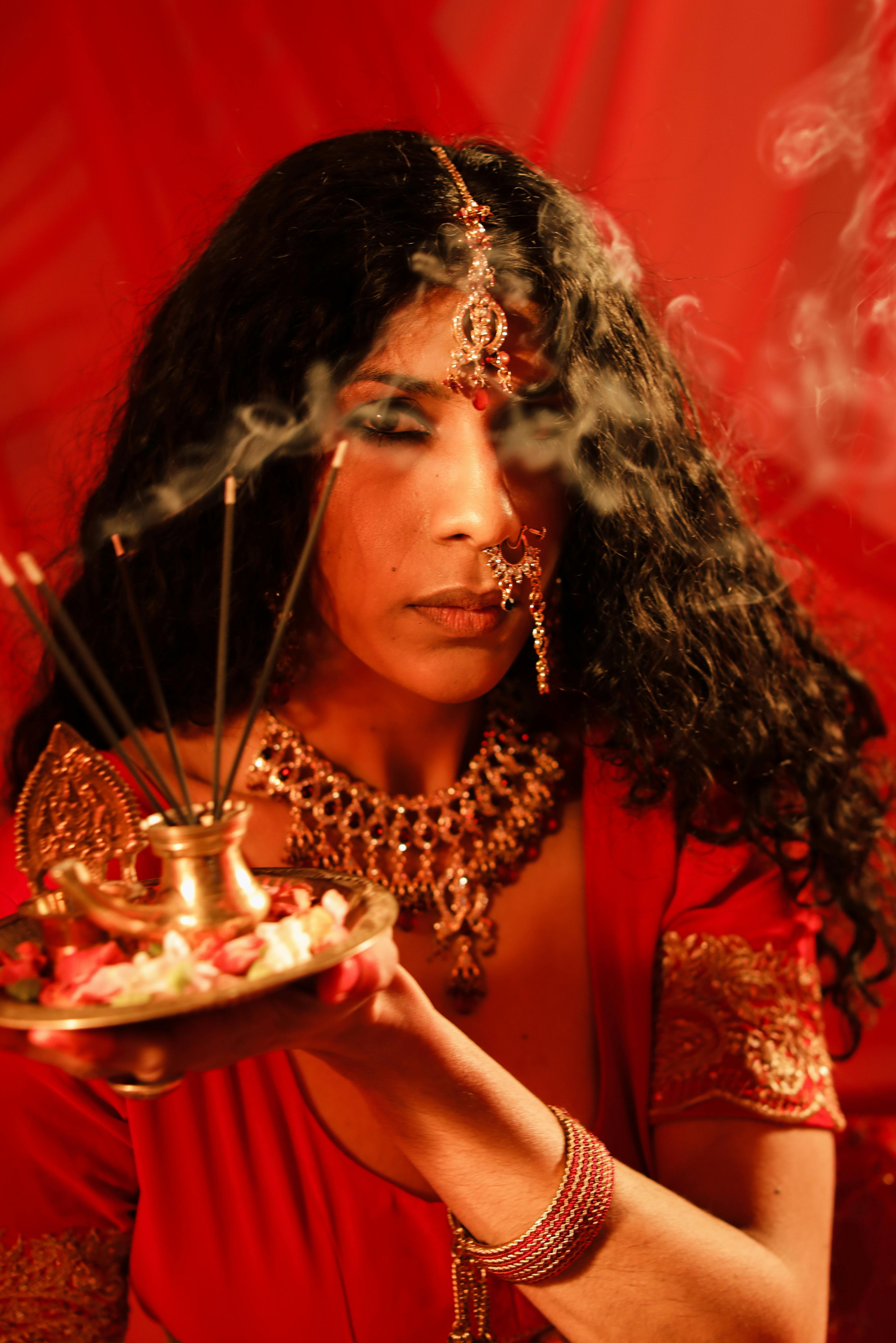 Close-Up Shot of a Woman in Red Traditional Clothing · Free Stock Photo