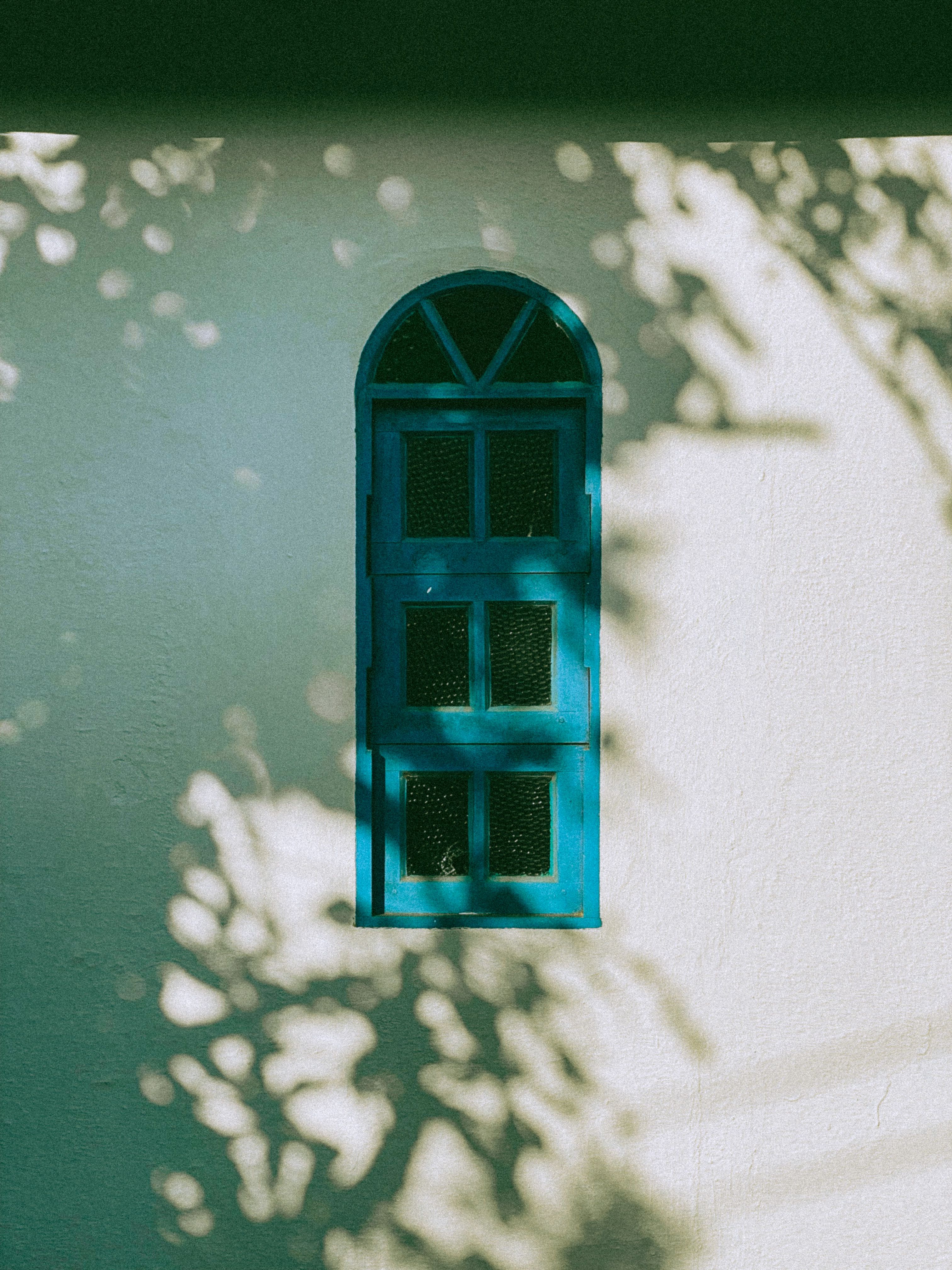 Blue Wooden Window Frame on a White Wall · Free Stock Photo