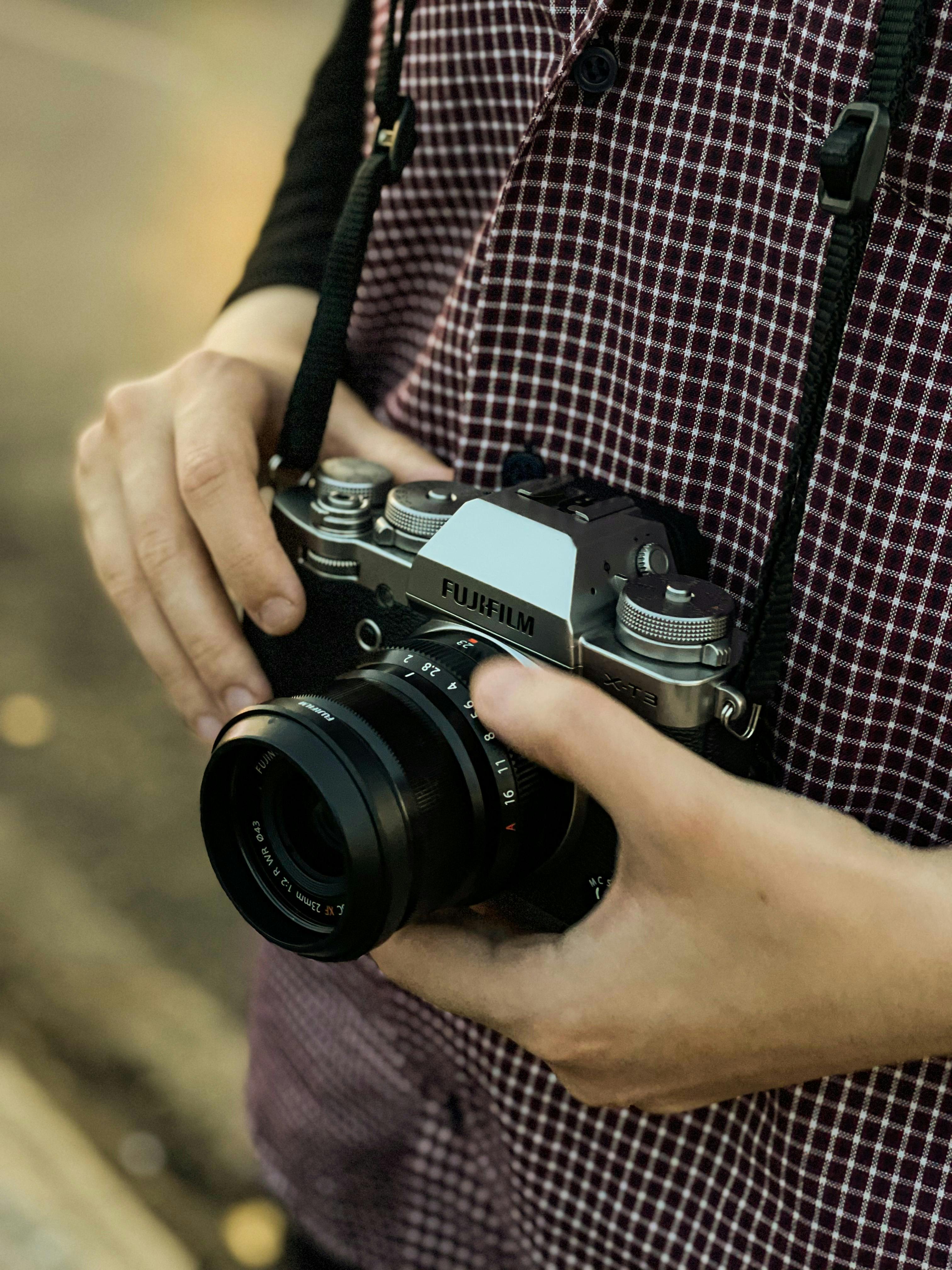 A Person Holding a Fujifilm Camera · Free Stock Photo