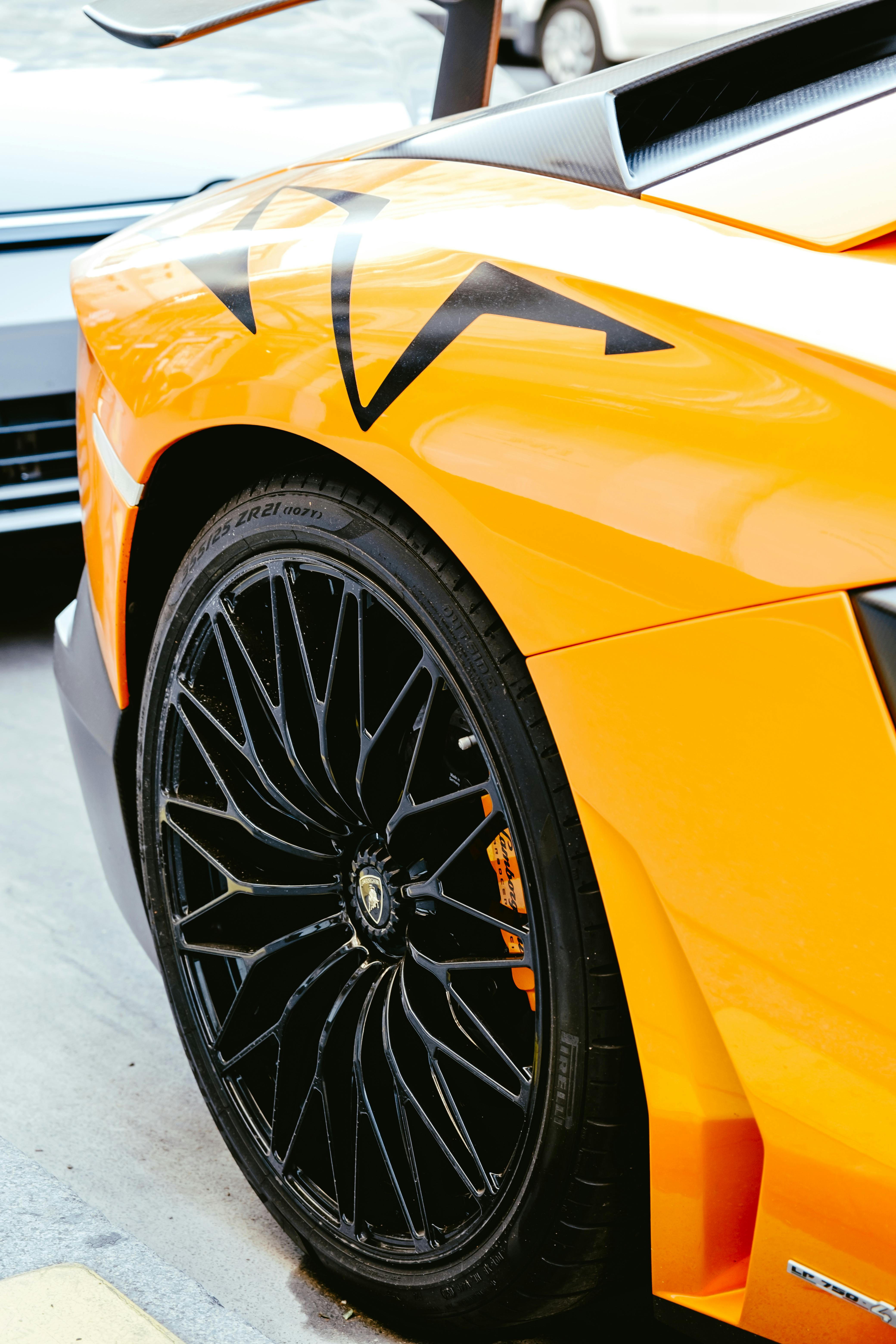 Black Mags of a Orange Lamborghini Aventador · Free Stock Photo