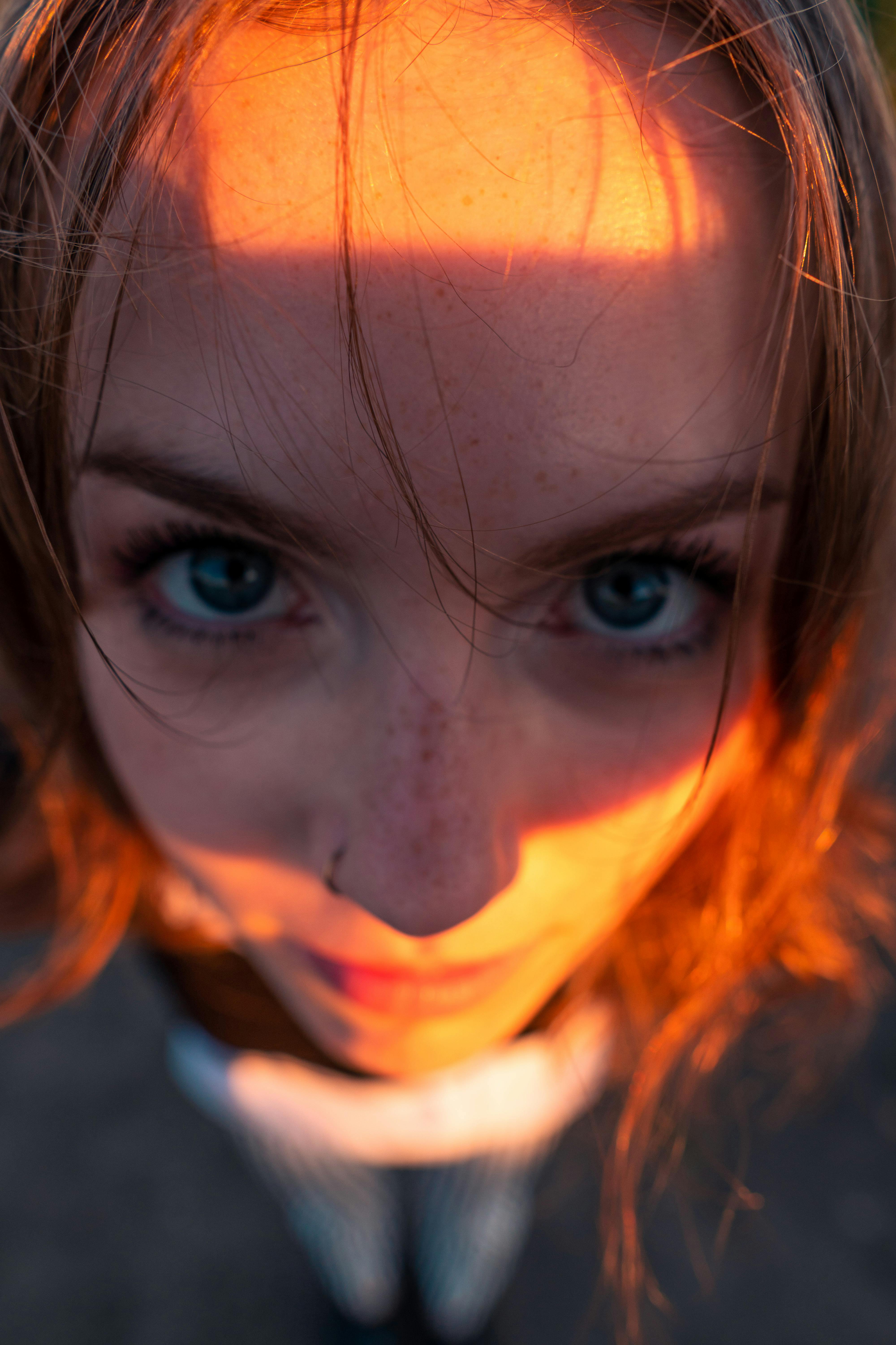 A Woman Seriously Looking at Camera in Close-up Photography · Free ...