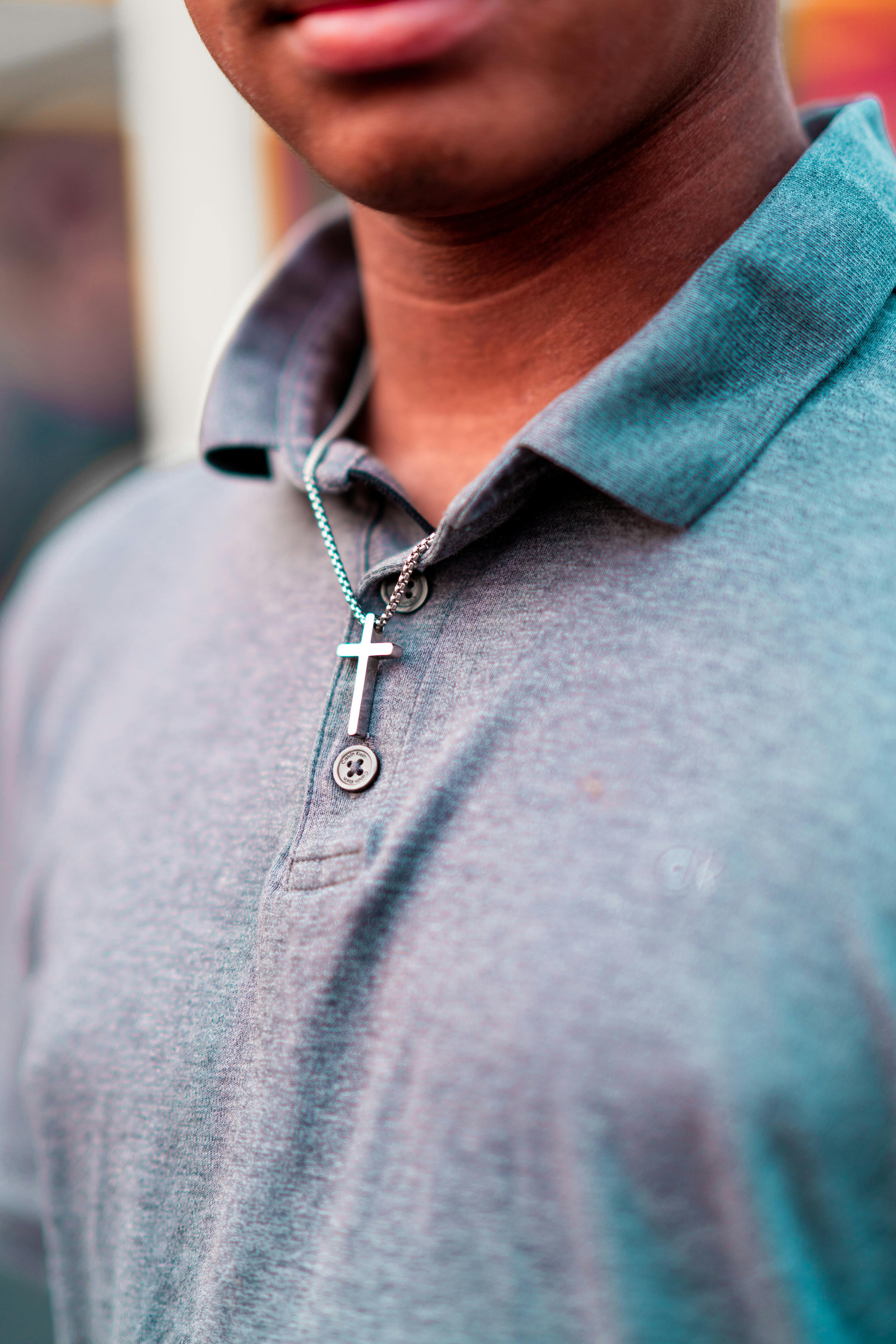 A Person Wearing a Cross Necklace · Free Stock Photo