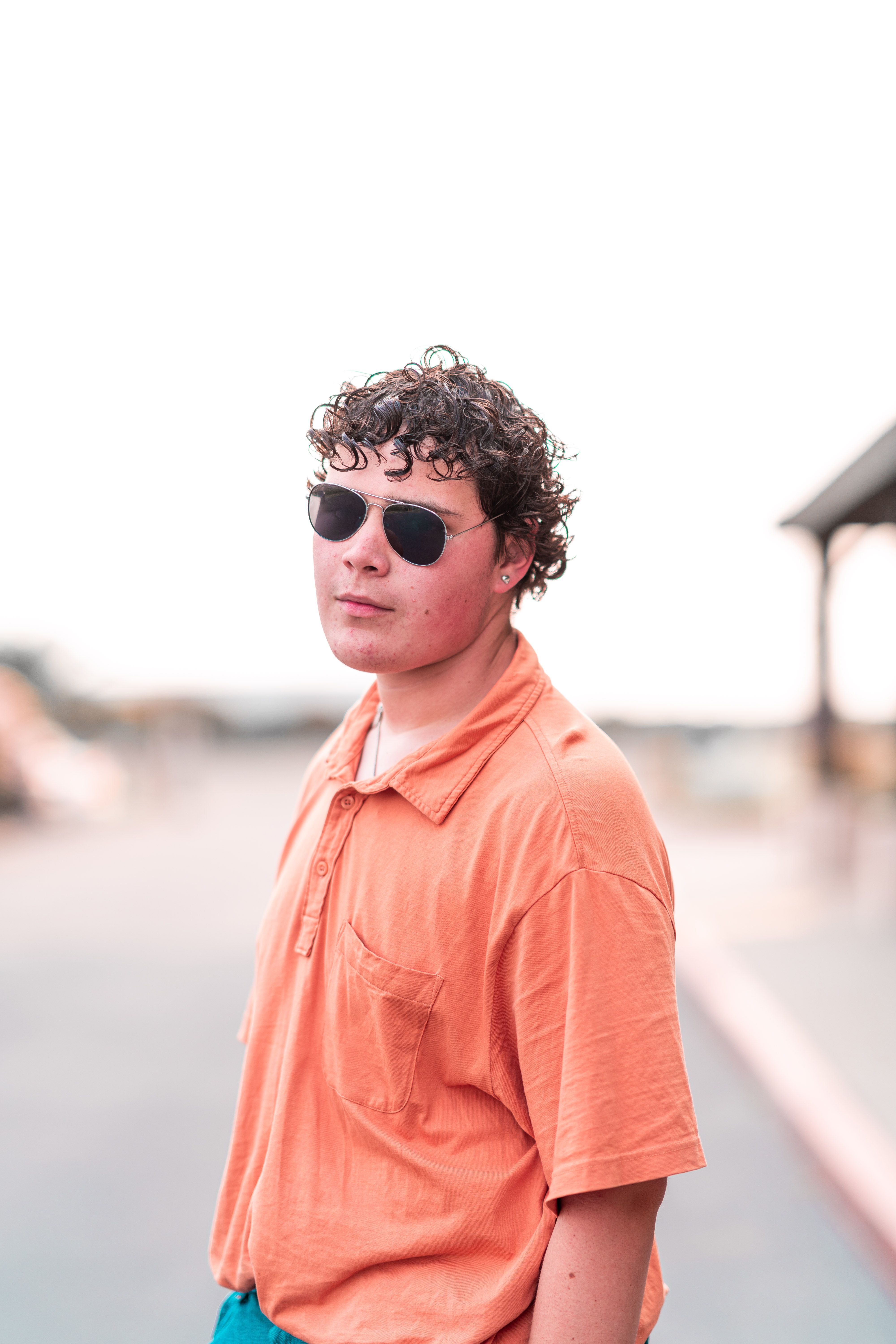 A Handsome Man Wearing a Red Polo Shirt · Free Stock Photo