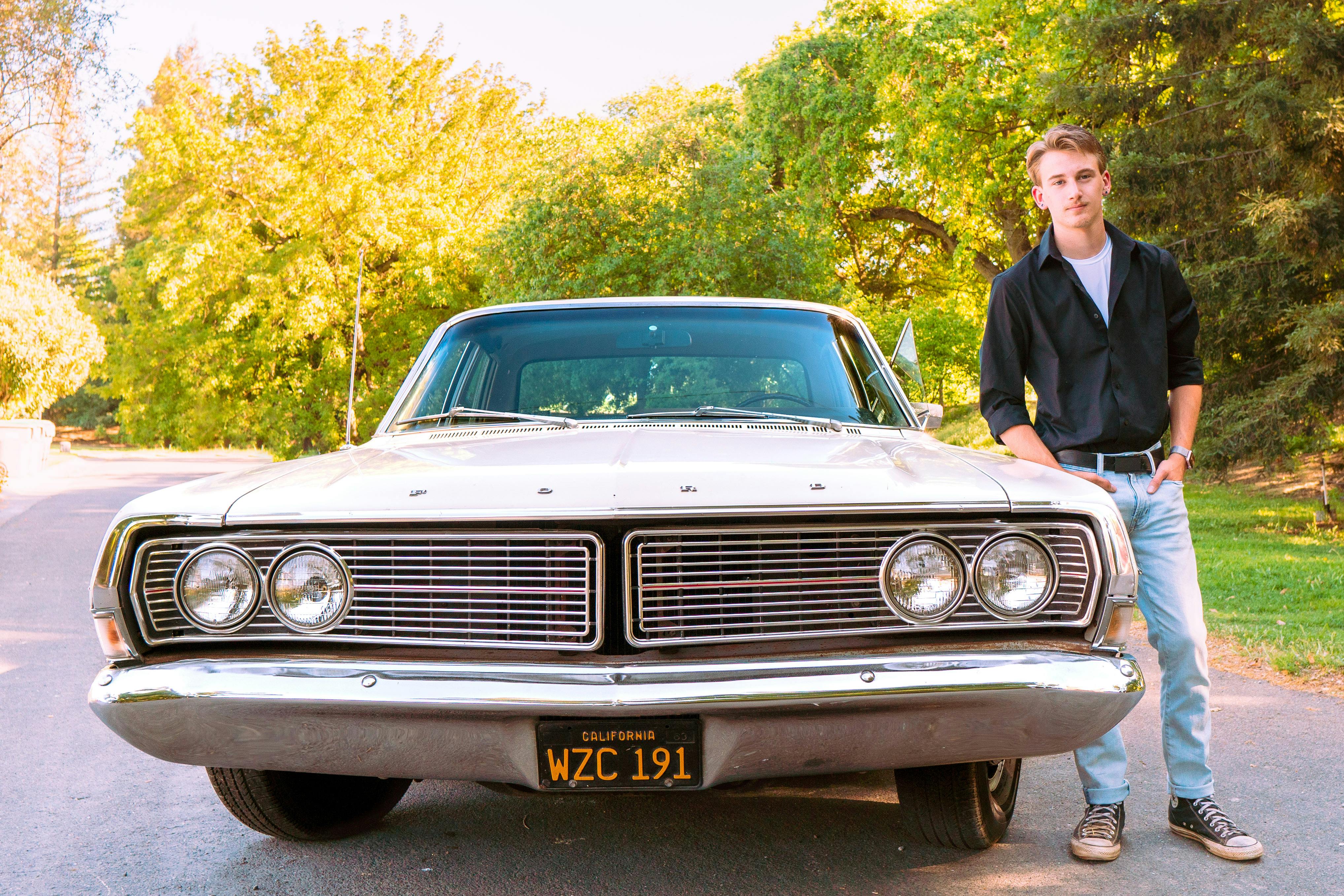 Man Standing on Top of a Car · Free Stock Photo