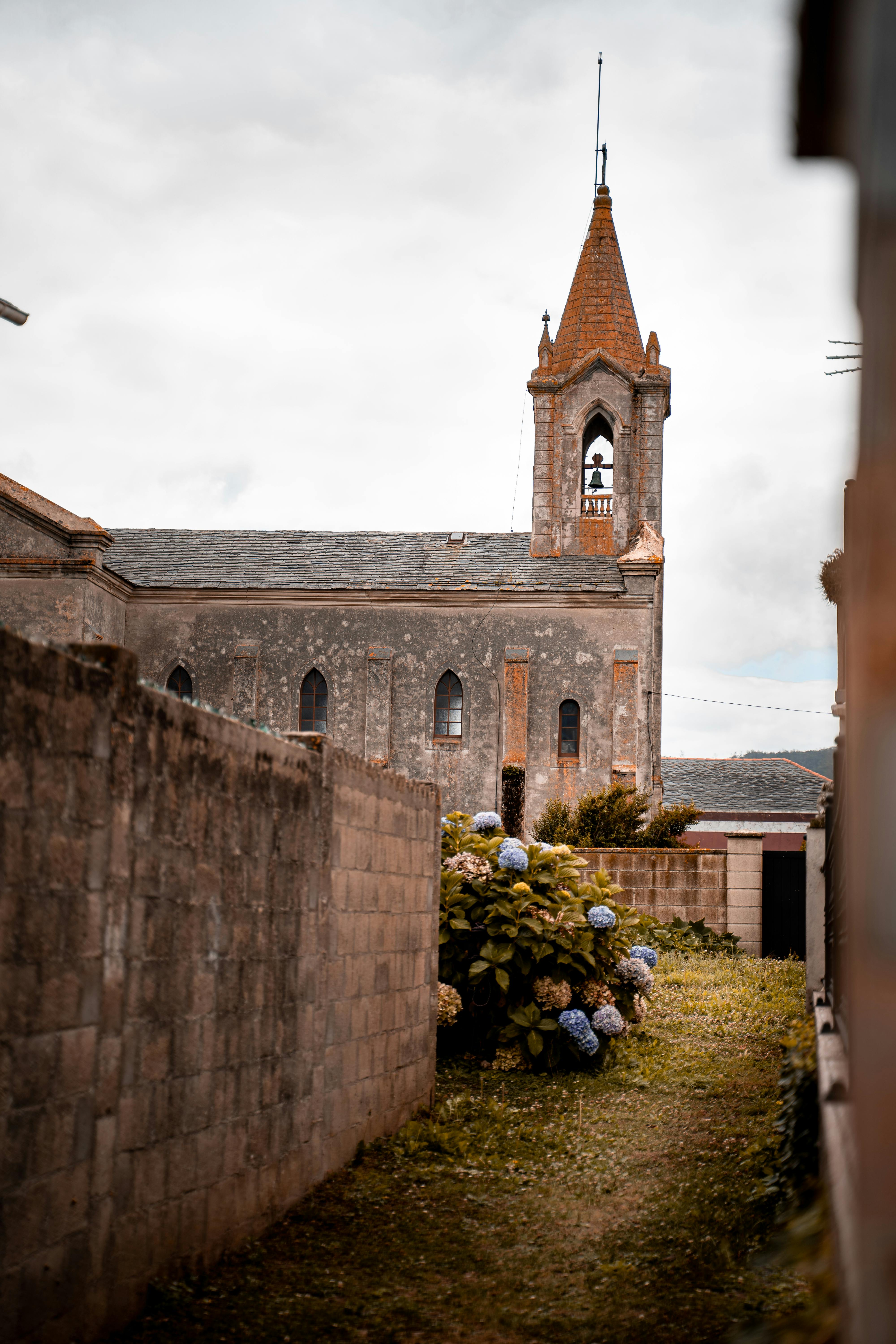 Brown Church Building with a Cross on Top · Free Stock Photo