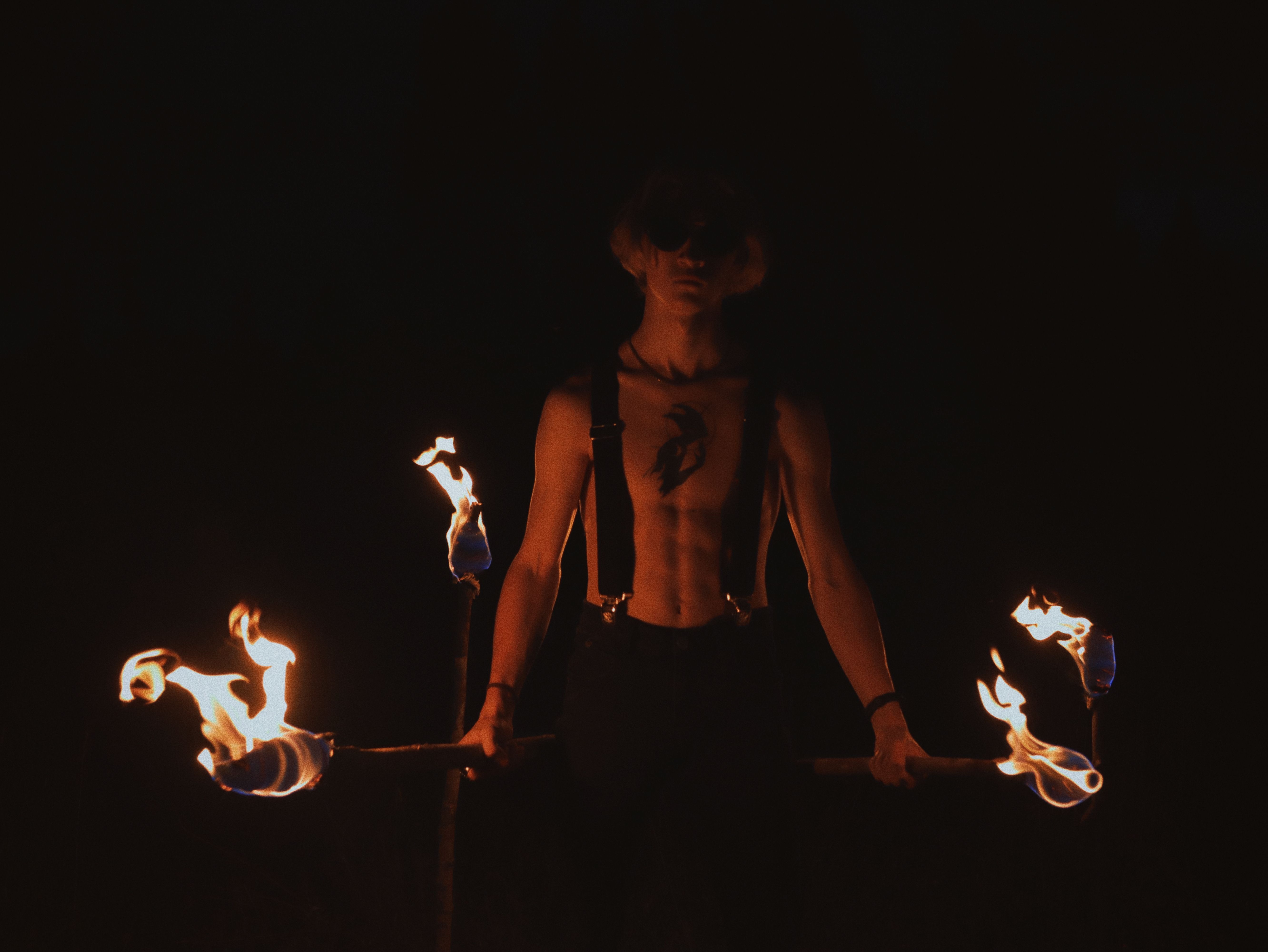 Man Standing near Fire at Night · Free Stock Photo