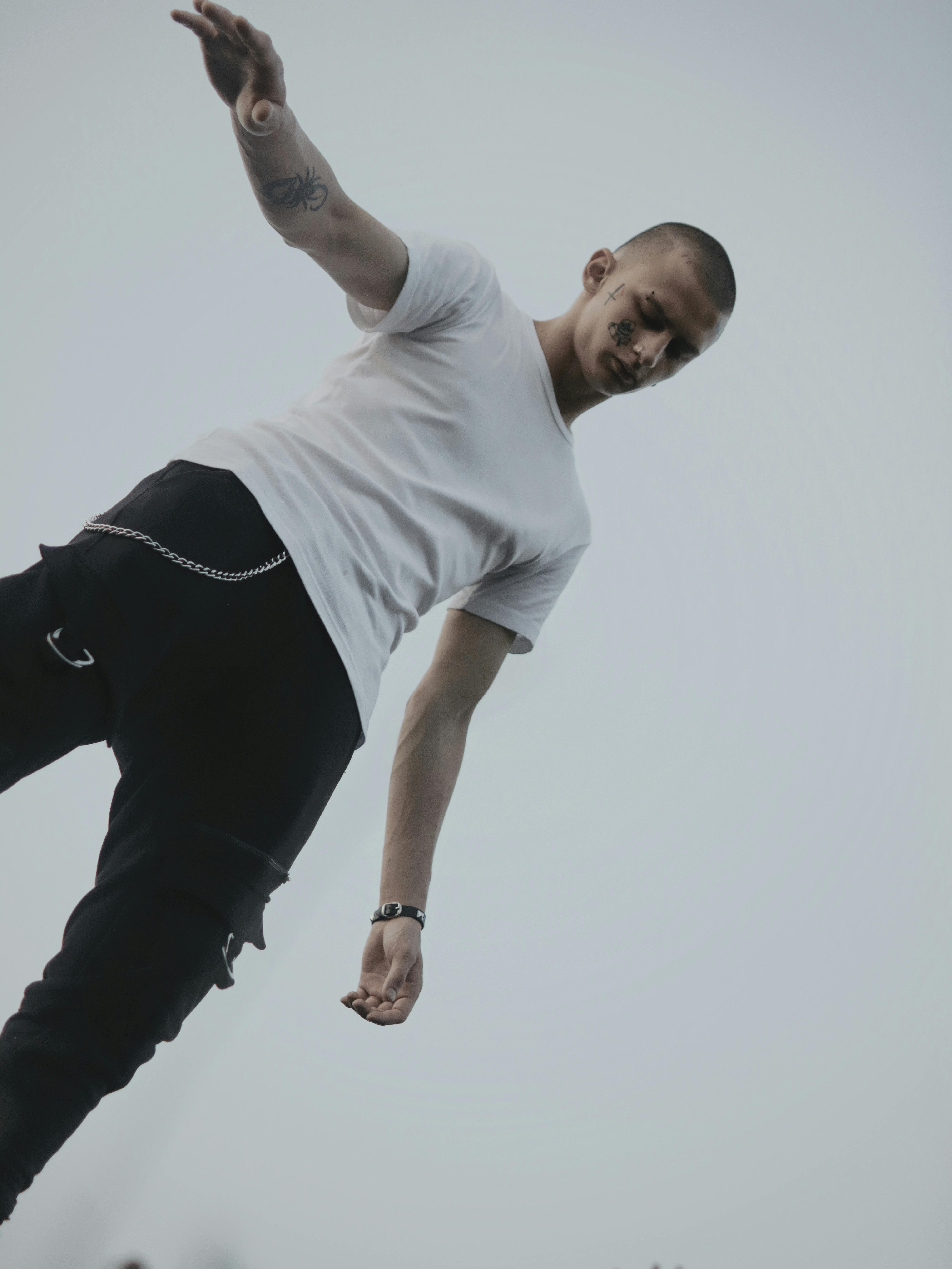 Low Angle Shot of a Man Standing · Free Stock Photo