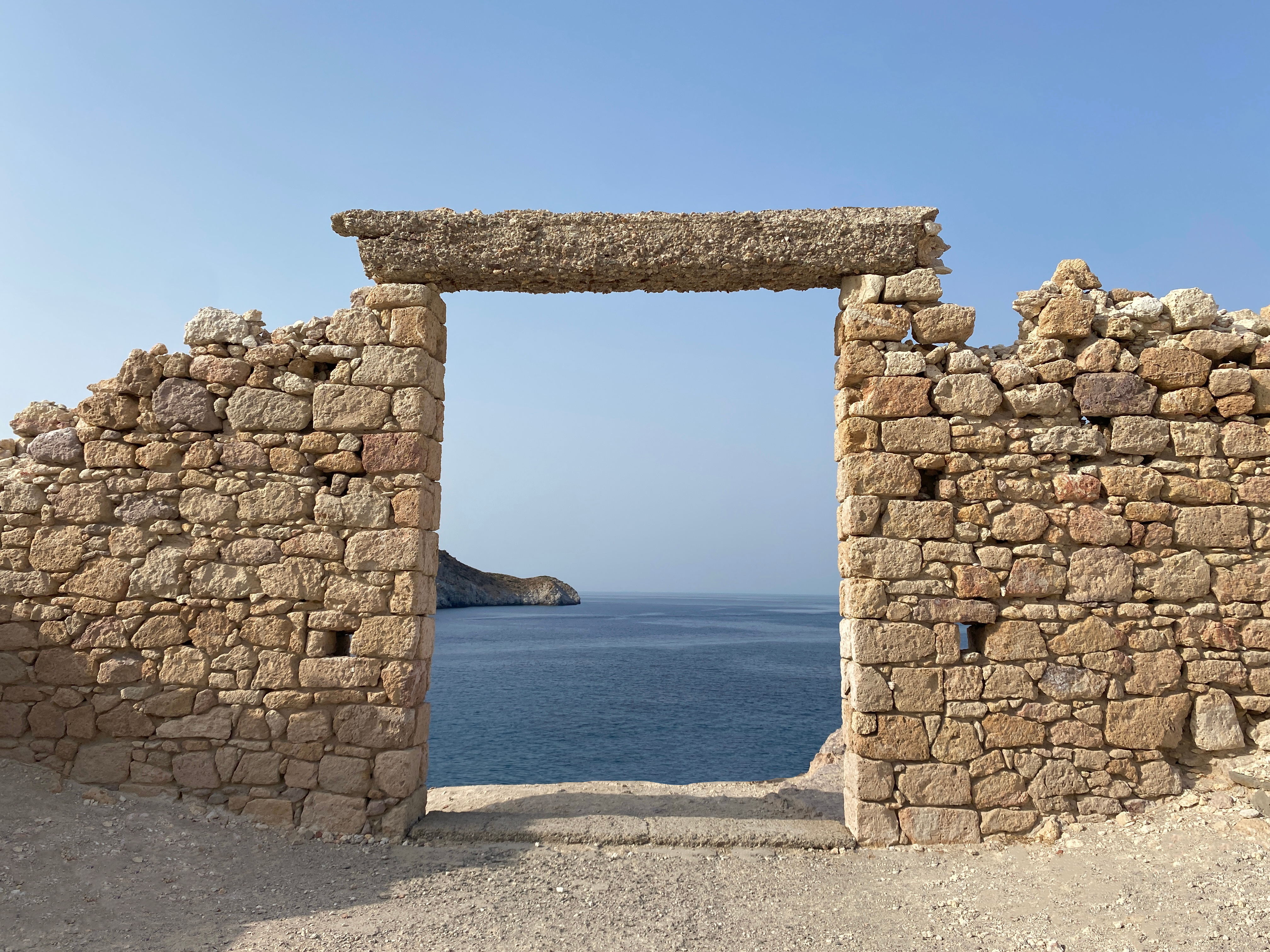 Brown Brick Arch Near Body of Water · Free Stock Photo