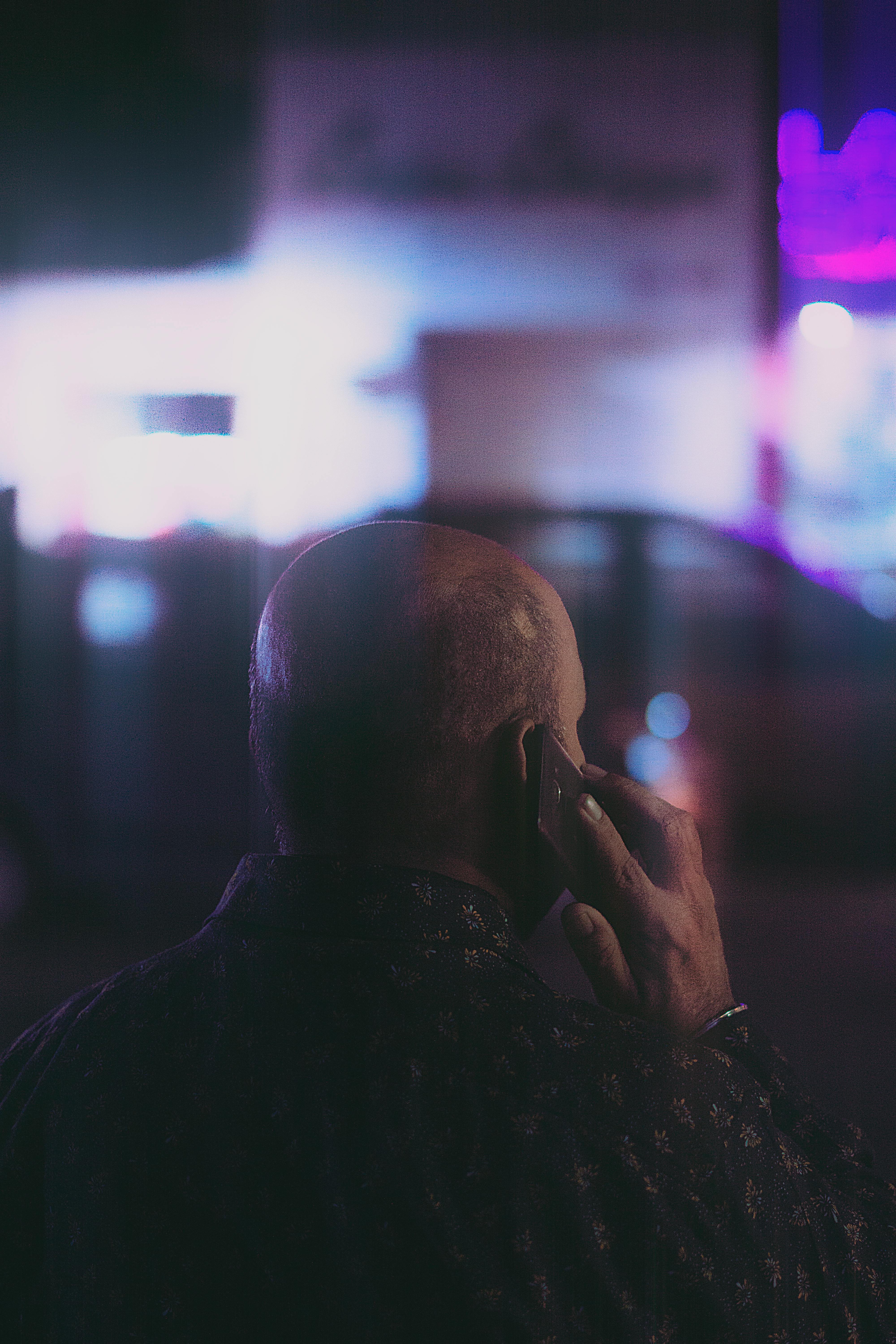 Back View Shot of a Man Having a Phone Call · Free Stock Photo
