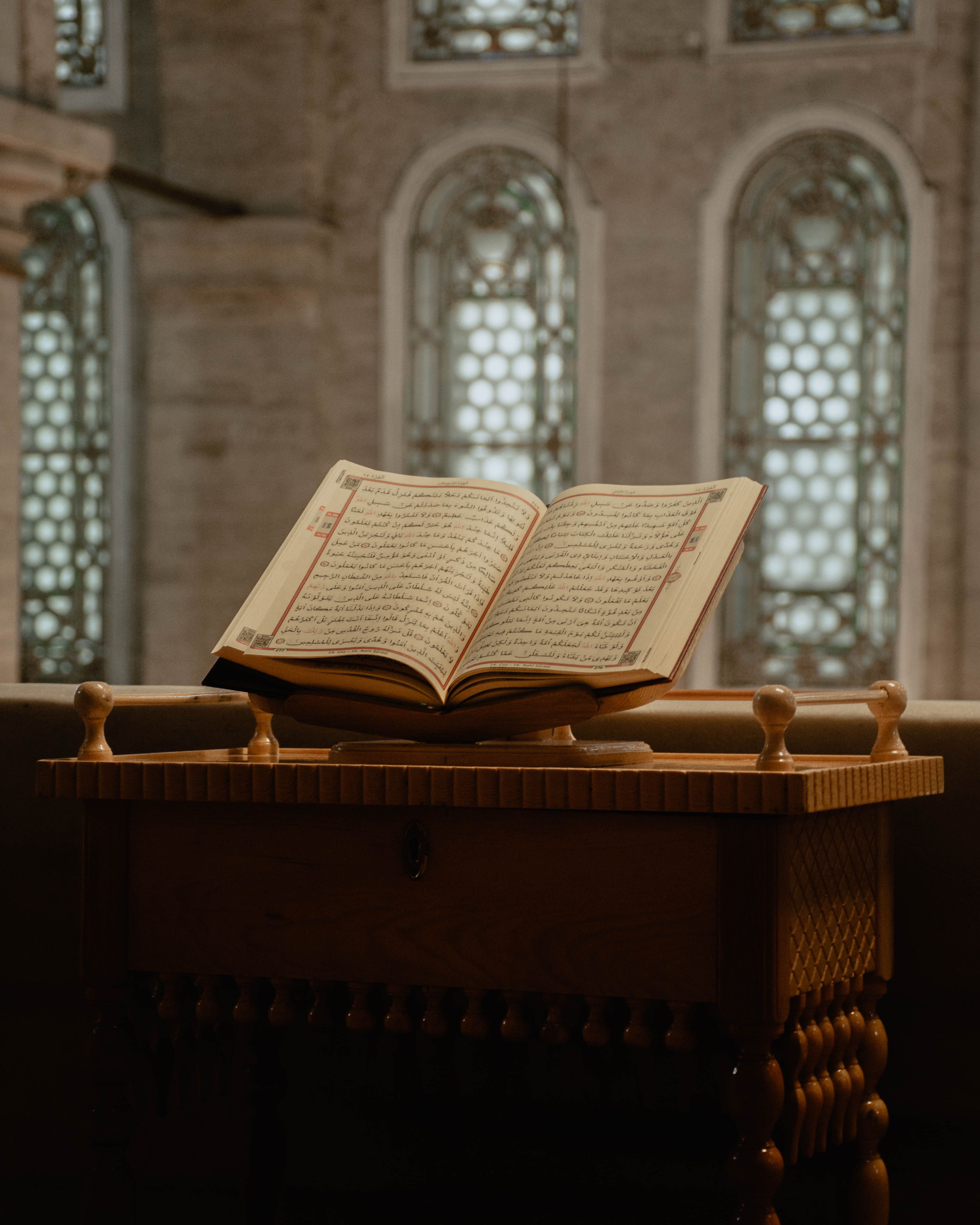 An Open Koran on a Wooden Table · Free Stock Photo