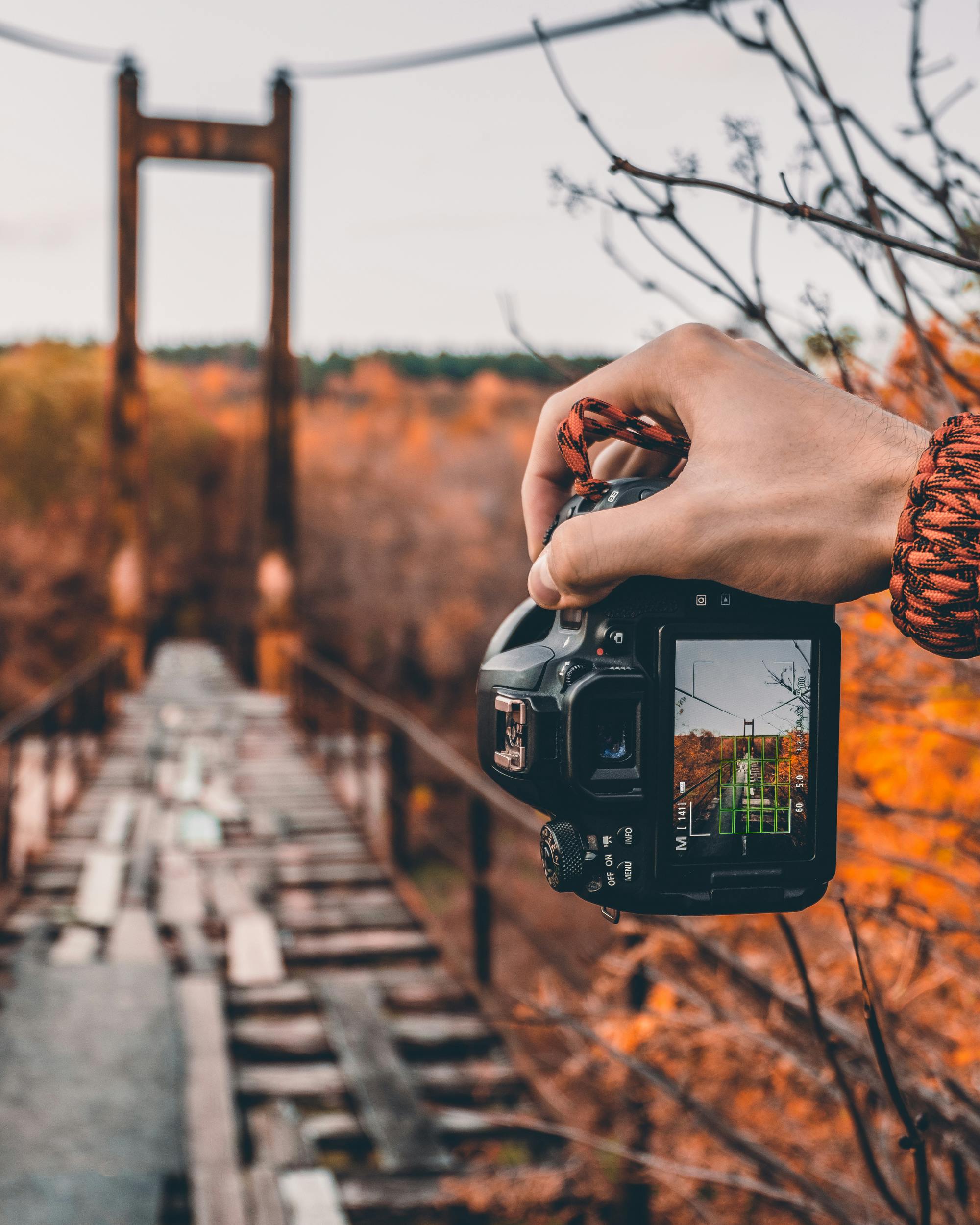 A Person Taking a Photo Using a DSLR Camera · Free Stock Photo
