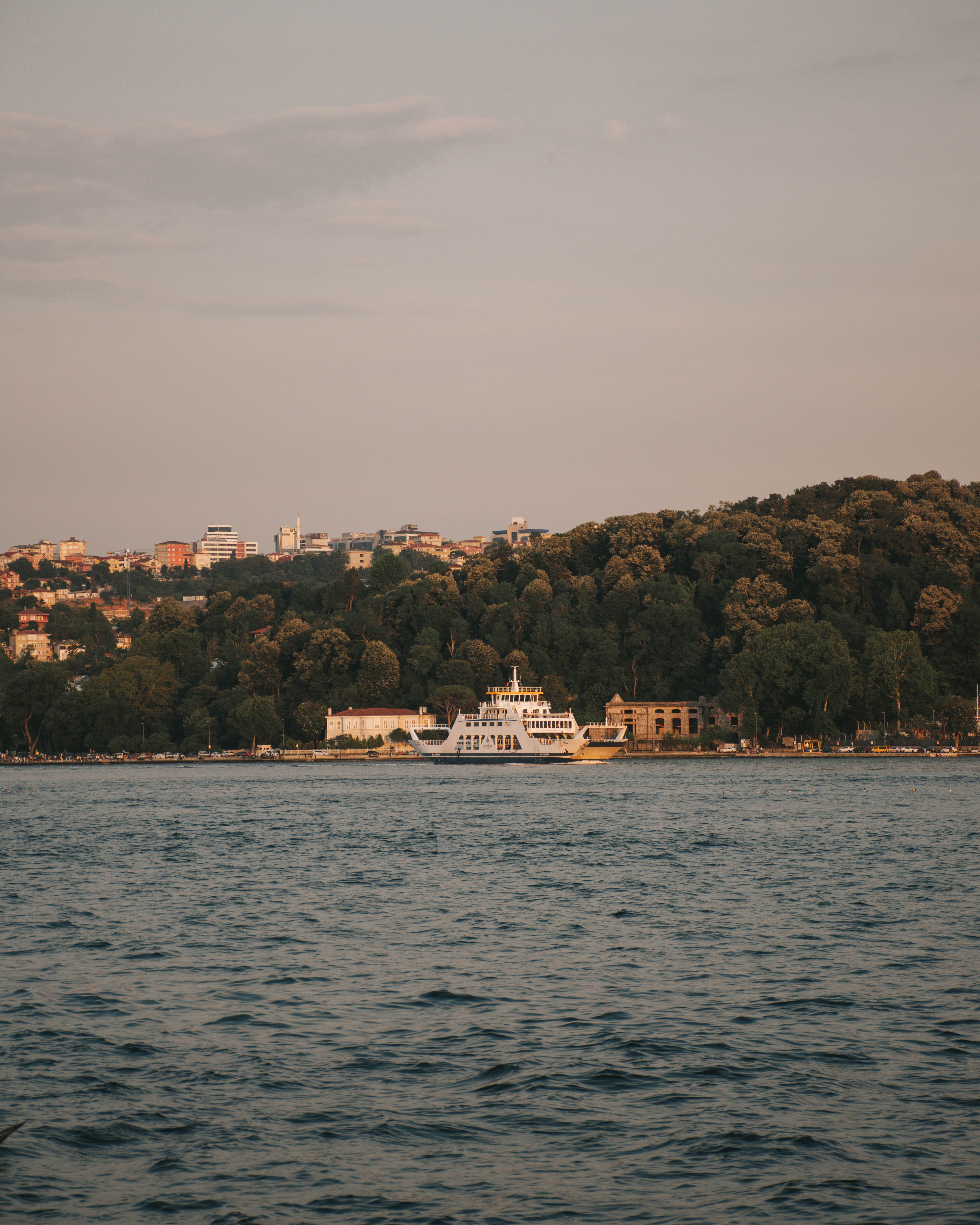 A Boat Sailing on the Sea Under Gloomy Sky · Free Stock Photo