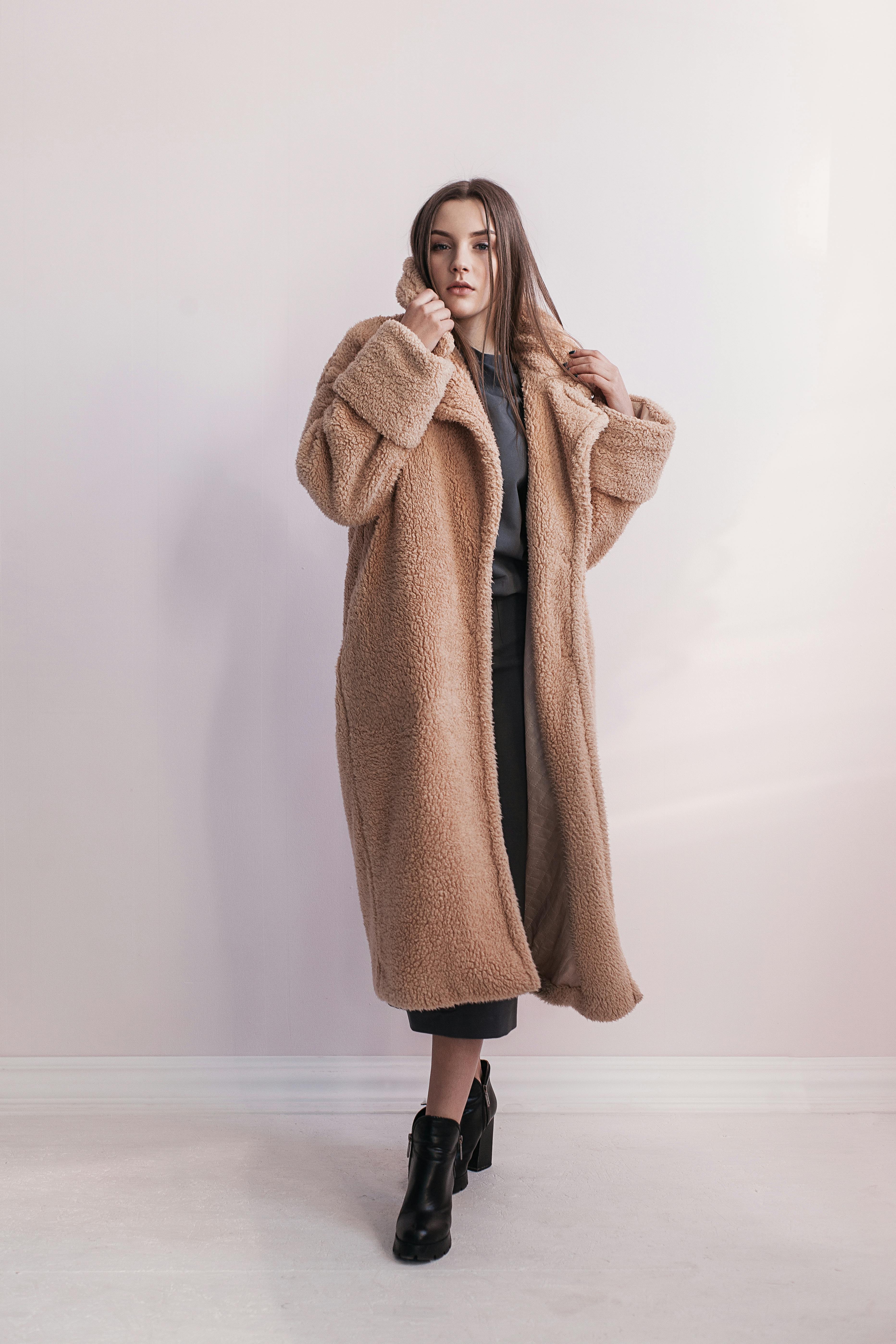 Portrait of woman posing in large doll box · Free Stock Photo