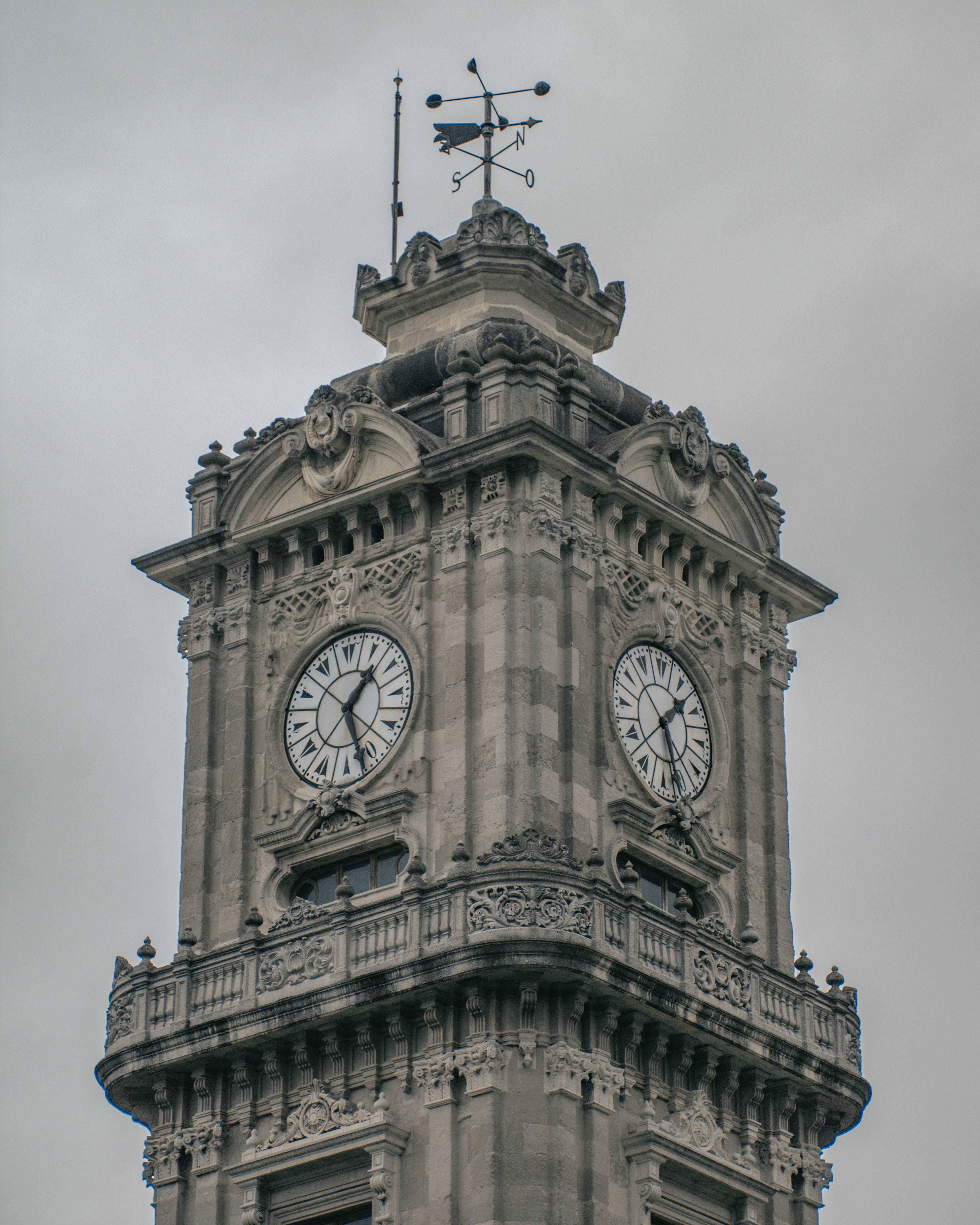 Brown Concrete Clock Tower Under White Clouds · Free Stock Photo