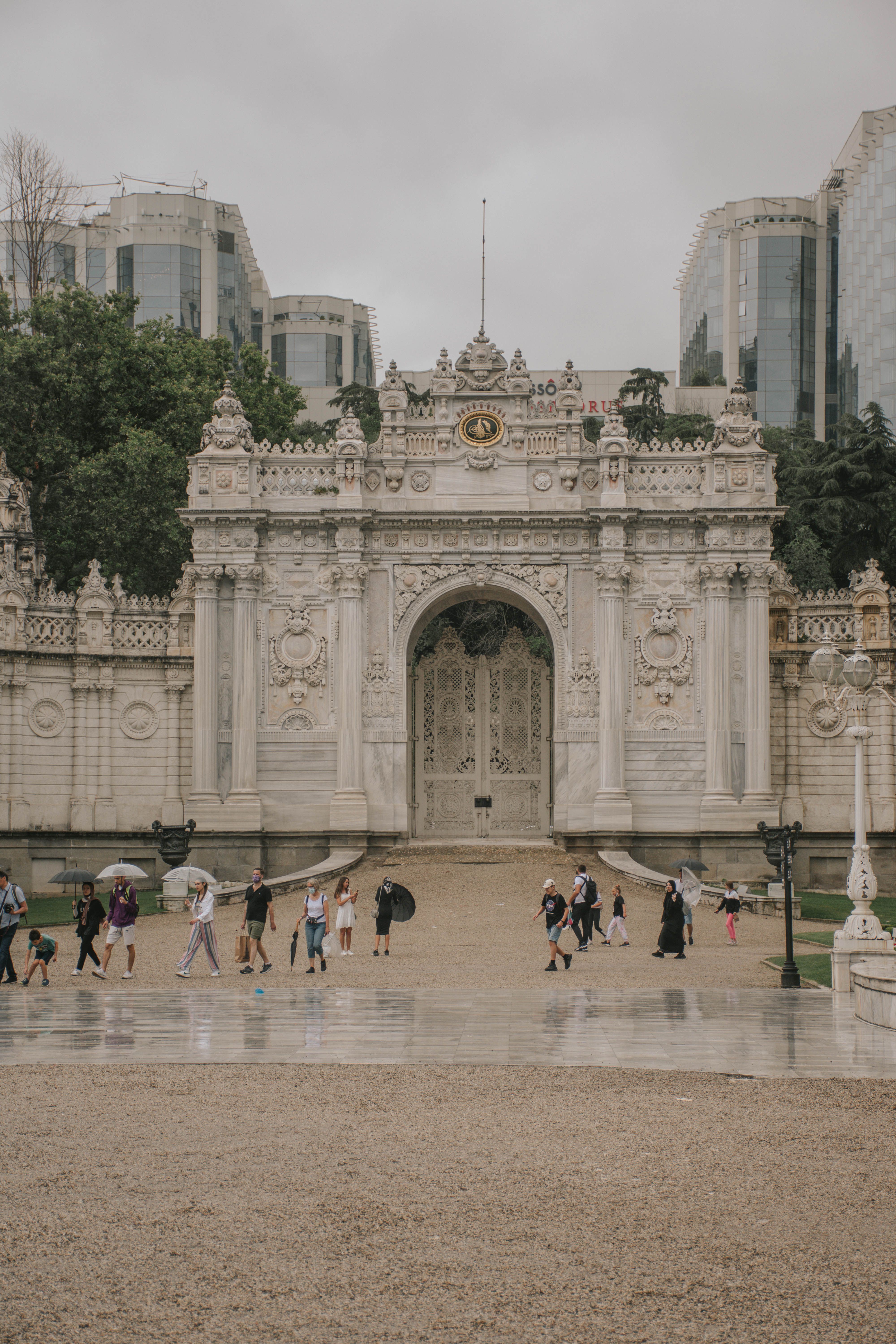 People Standing Outside the Concrete Building · Free Stock Photo