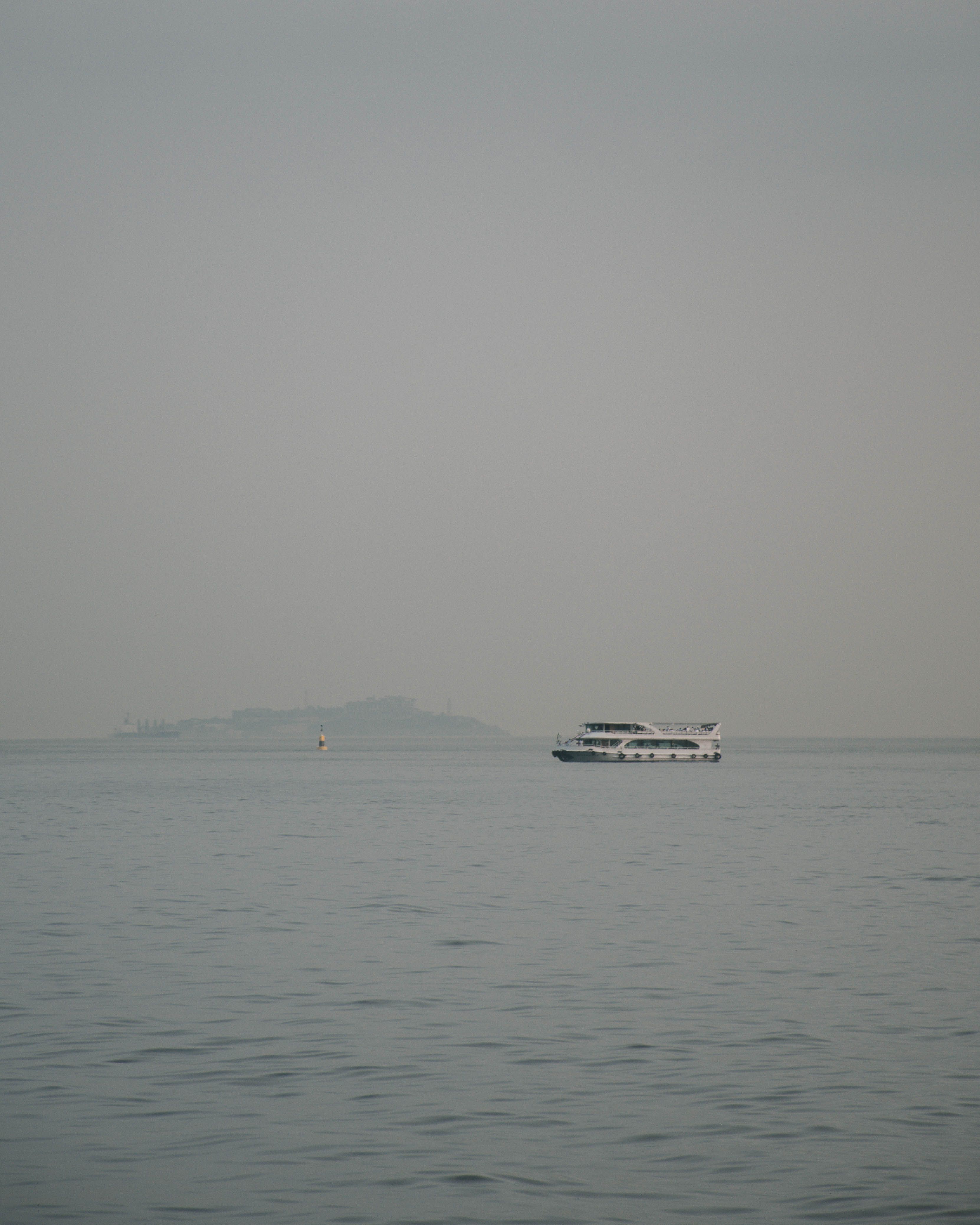 Gray Seascape with a Ferry · Free Stock Photo