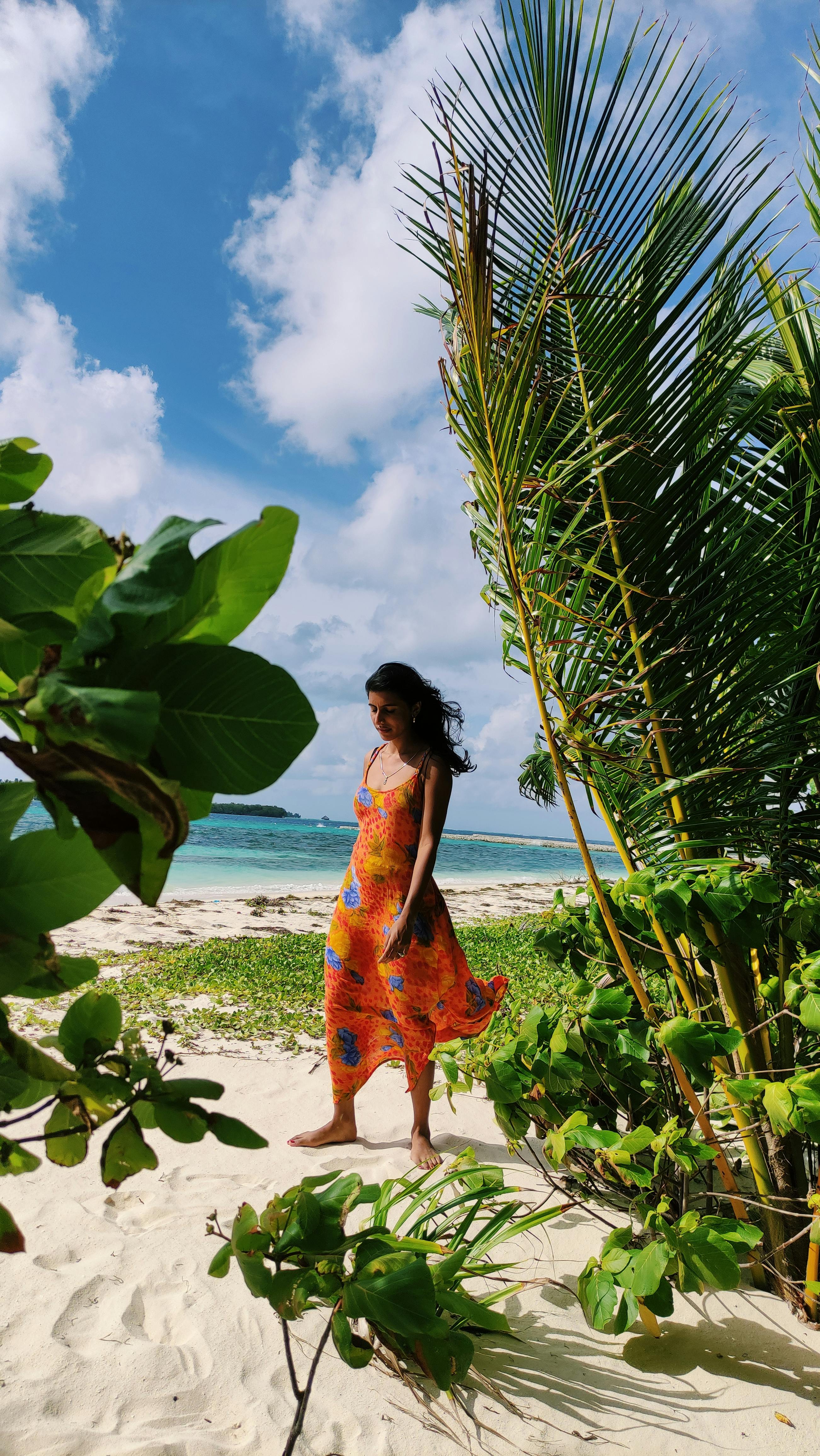 Woman in White Dress Wearing a Hat at the Beach · Free Stock Photo