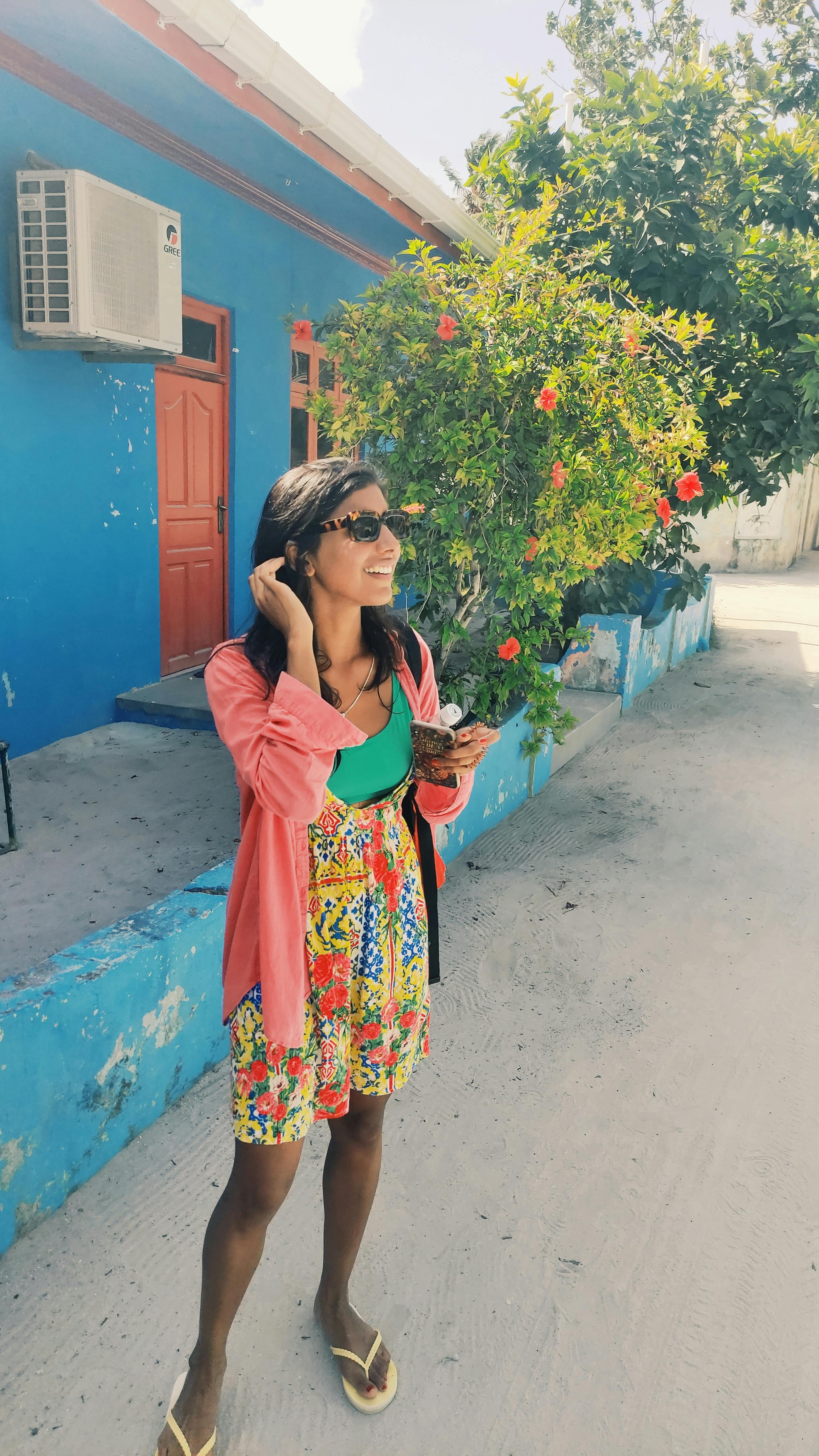 Standing Woman in Multi Colored Clothing · Free Stock Photo