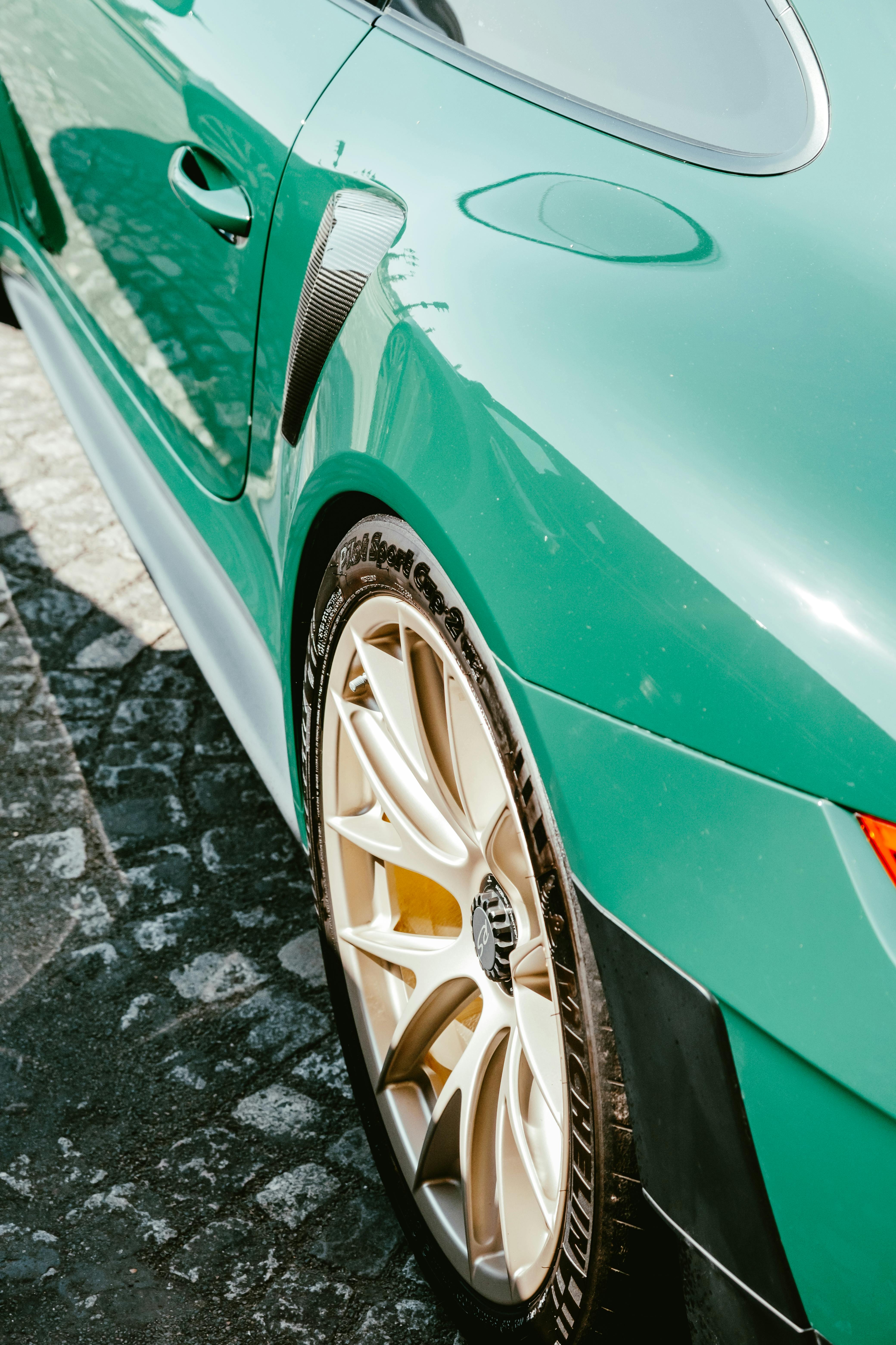 Green Car on Gray Stone Pavement · Free Stock Photo