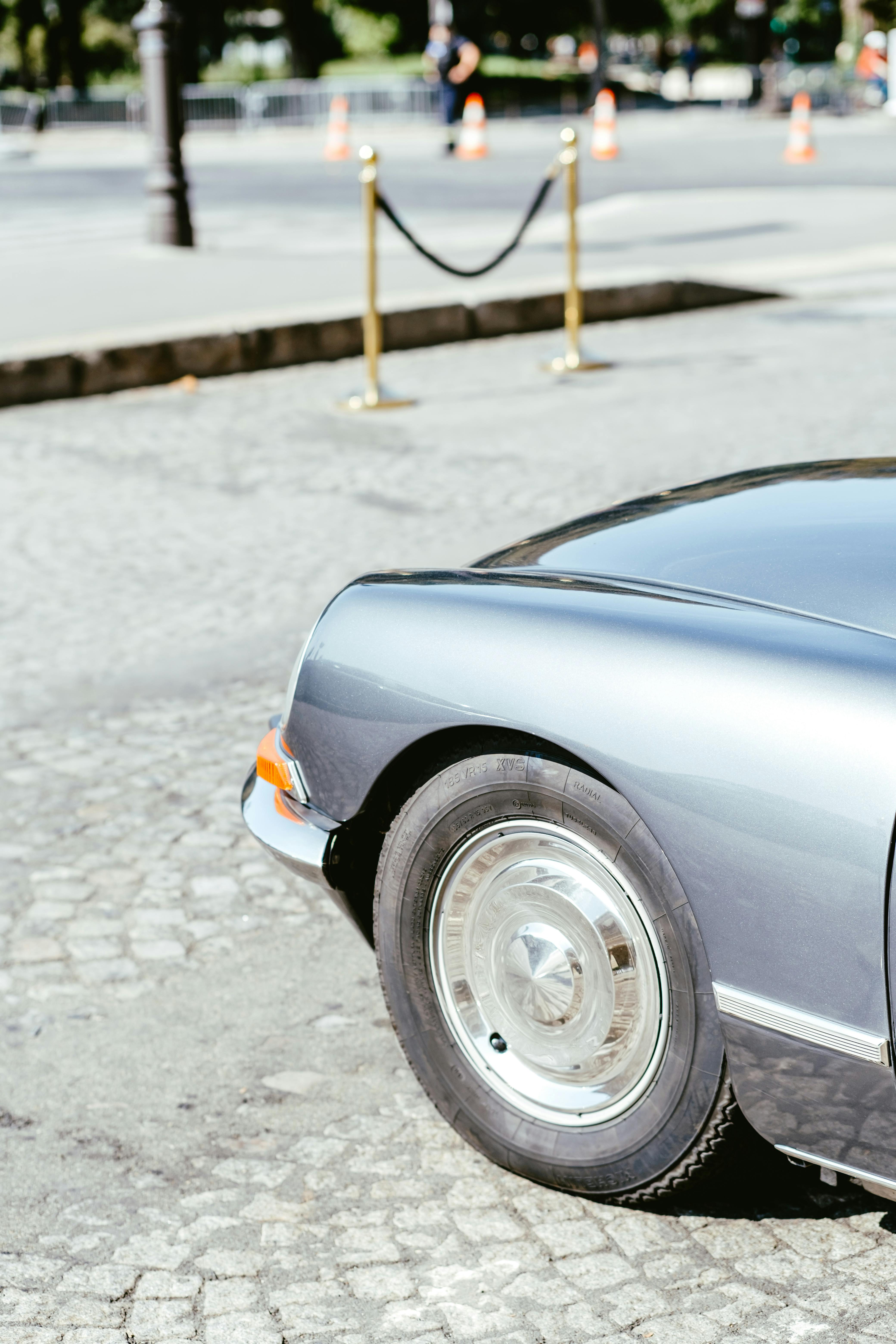 Shiny Grey Car on Pavement · Free Stock Photo
