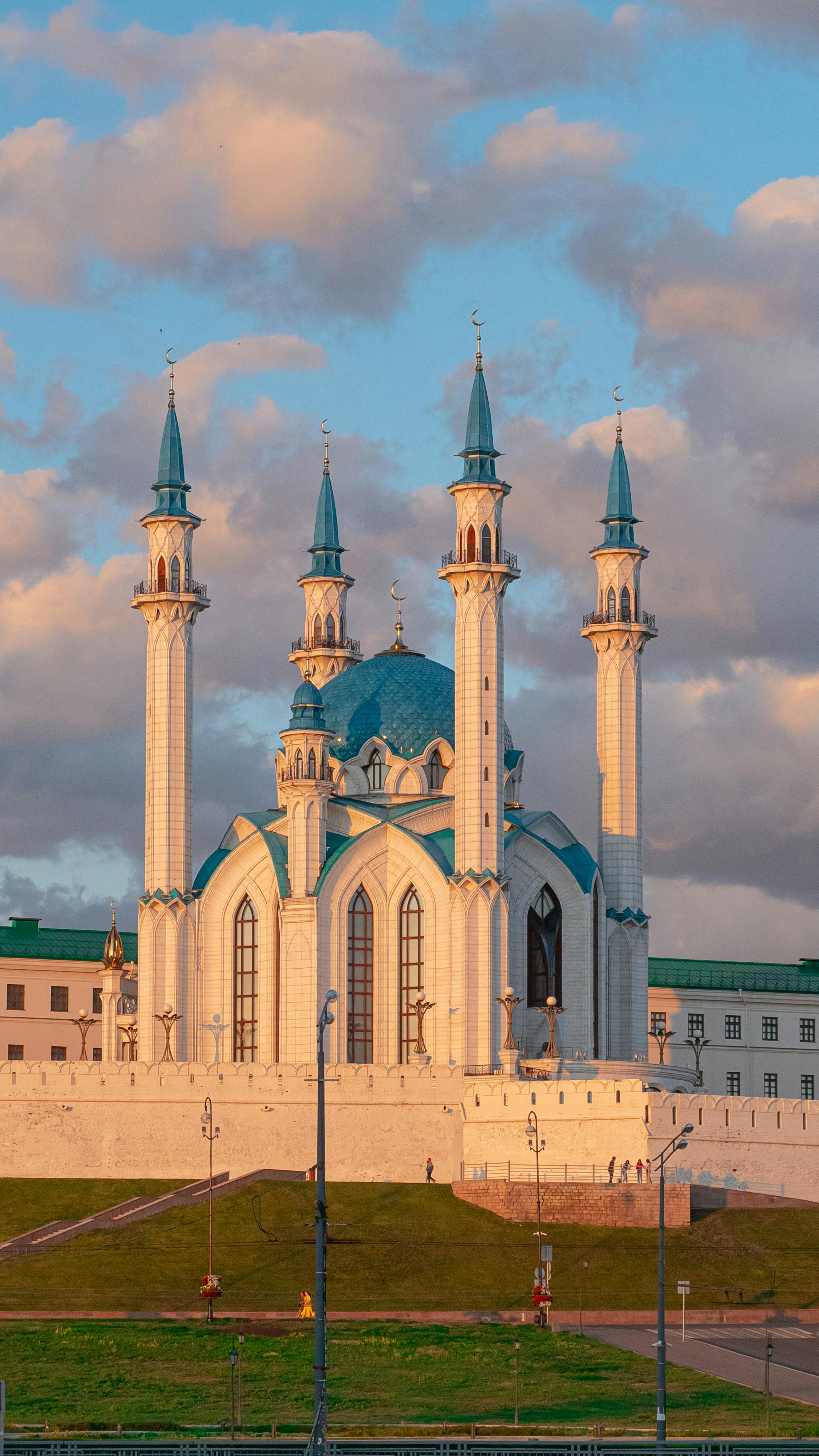 Woman Sitting in Mosque Corner · Free Stock Photo