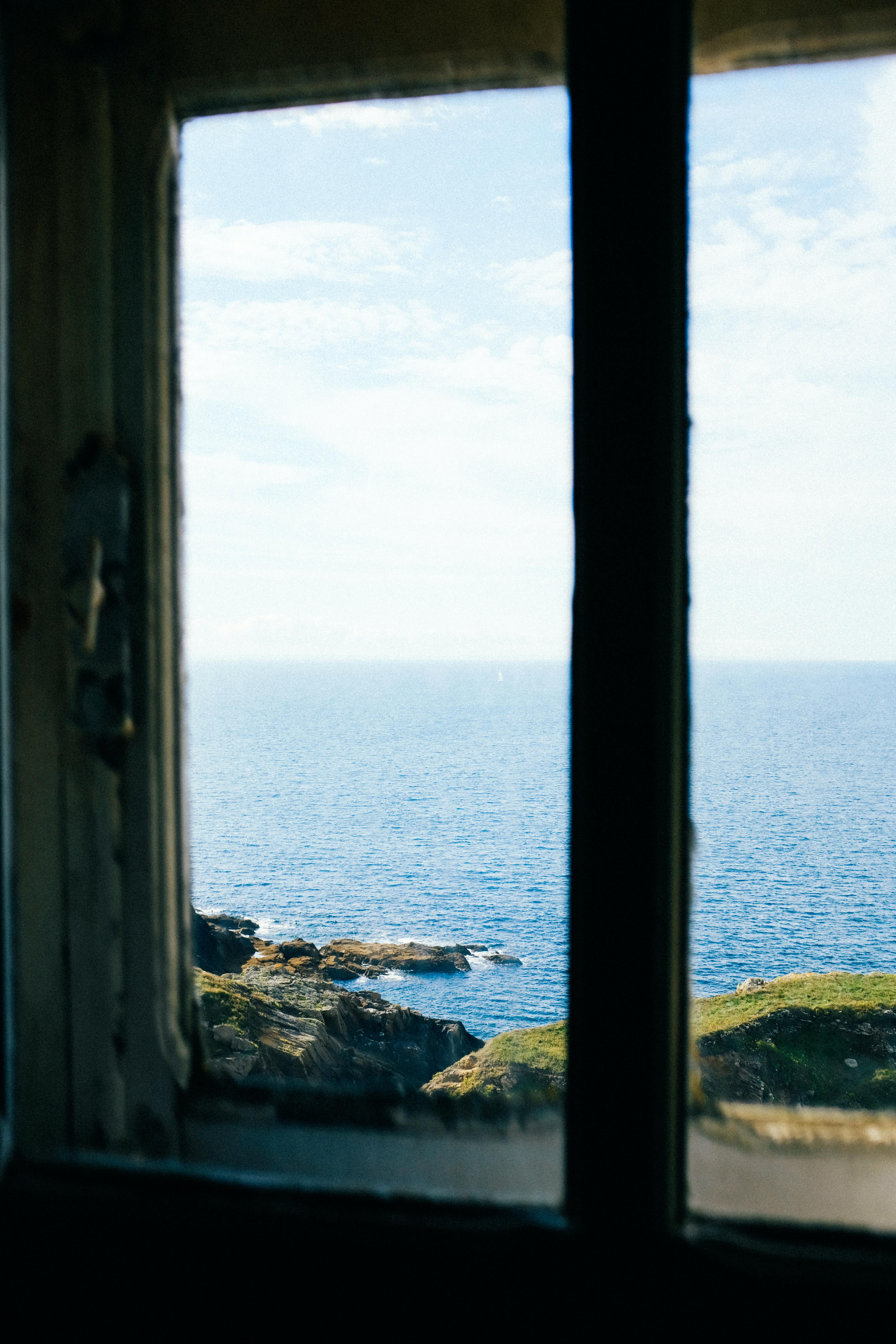 Shore and Sea Through a Window · Free Stock Photo