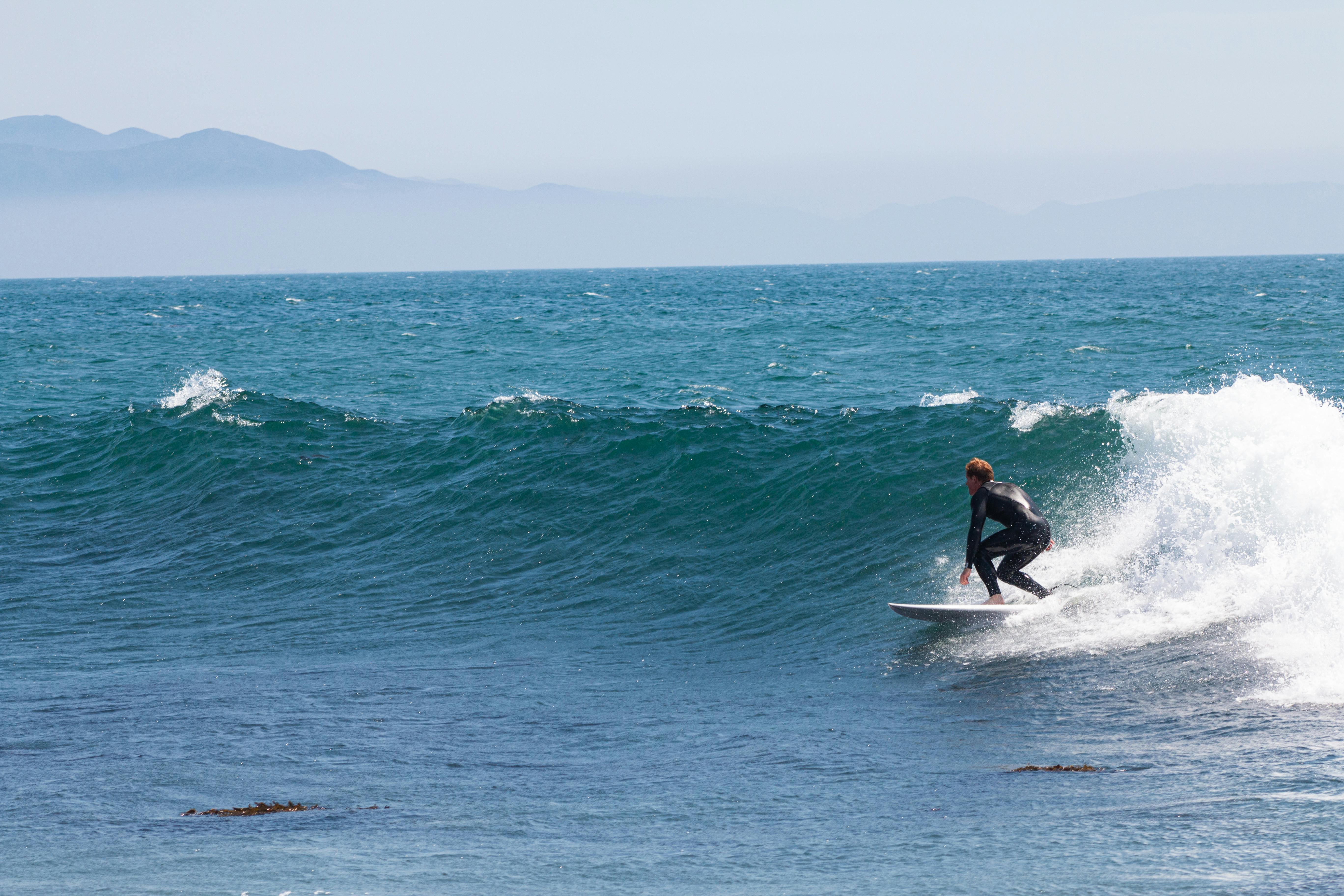 Person Surfing on Sea · Free Stock Photo