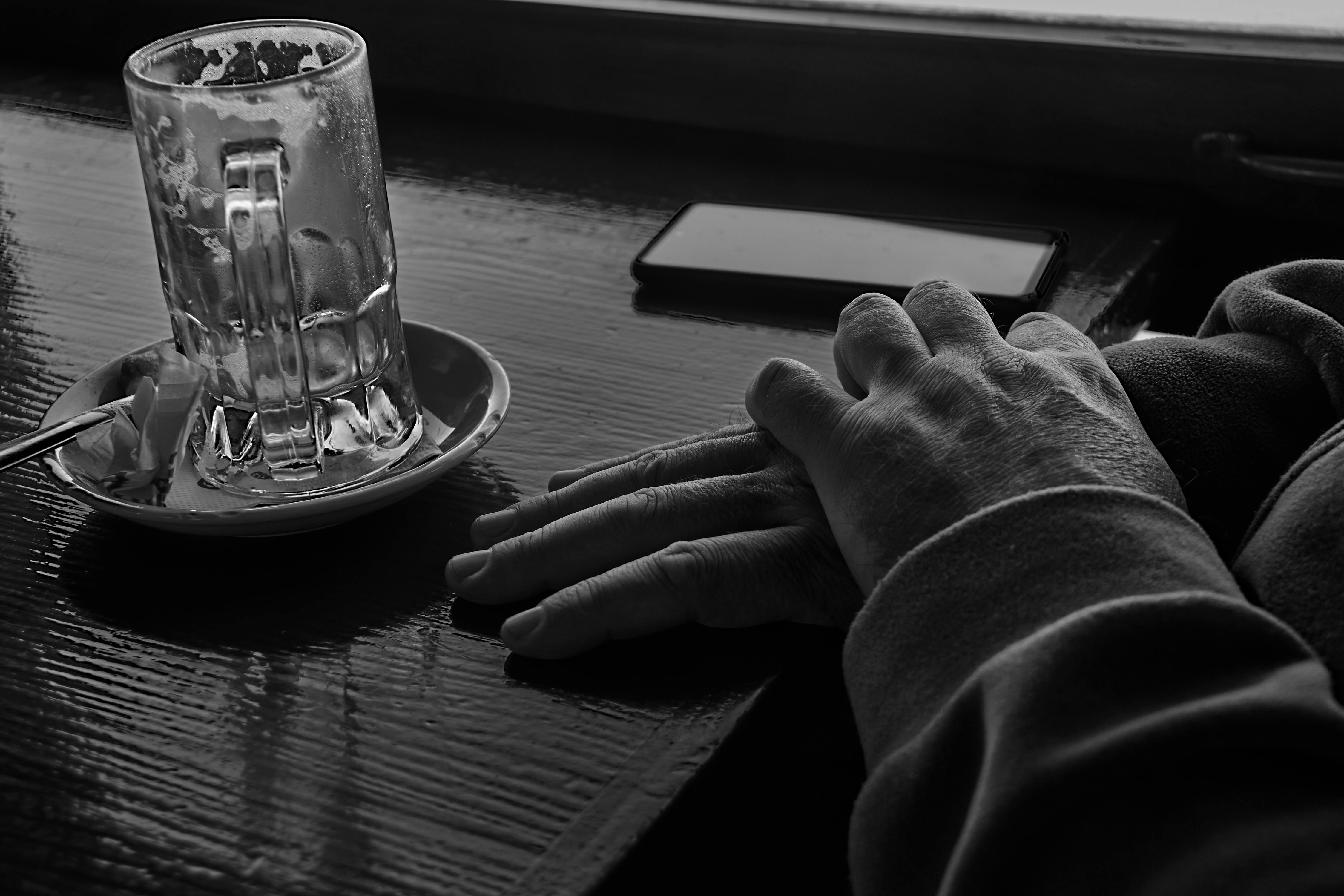 Grayscale Photo of a Prisoner Inside the Jail · Free Stock Photo