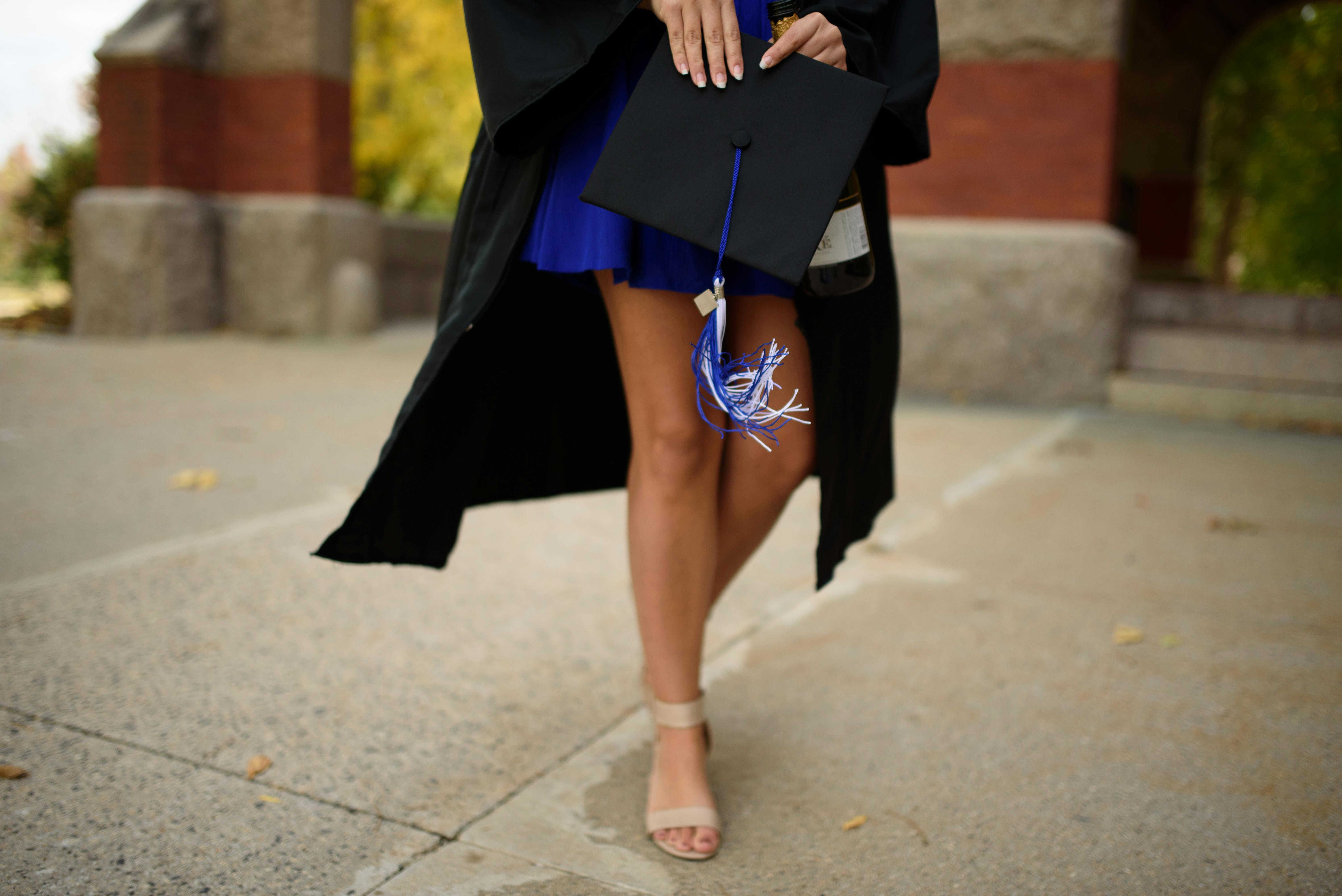 Man Wearing Black Graduation Gown and Cap · Free Stock Photo