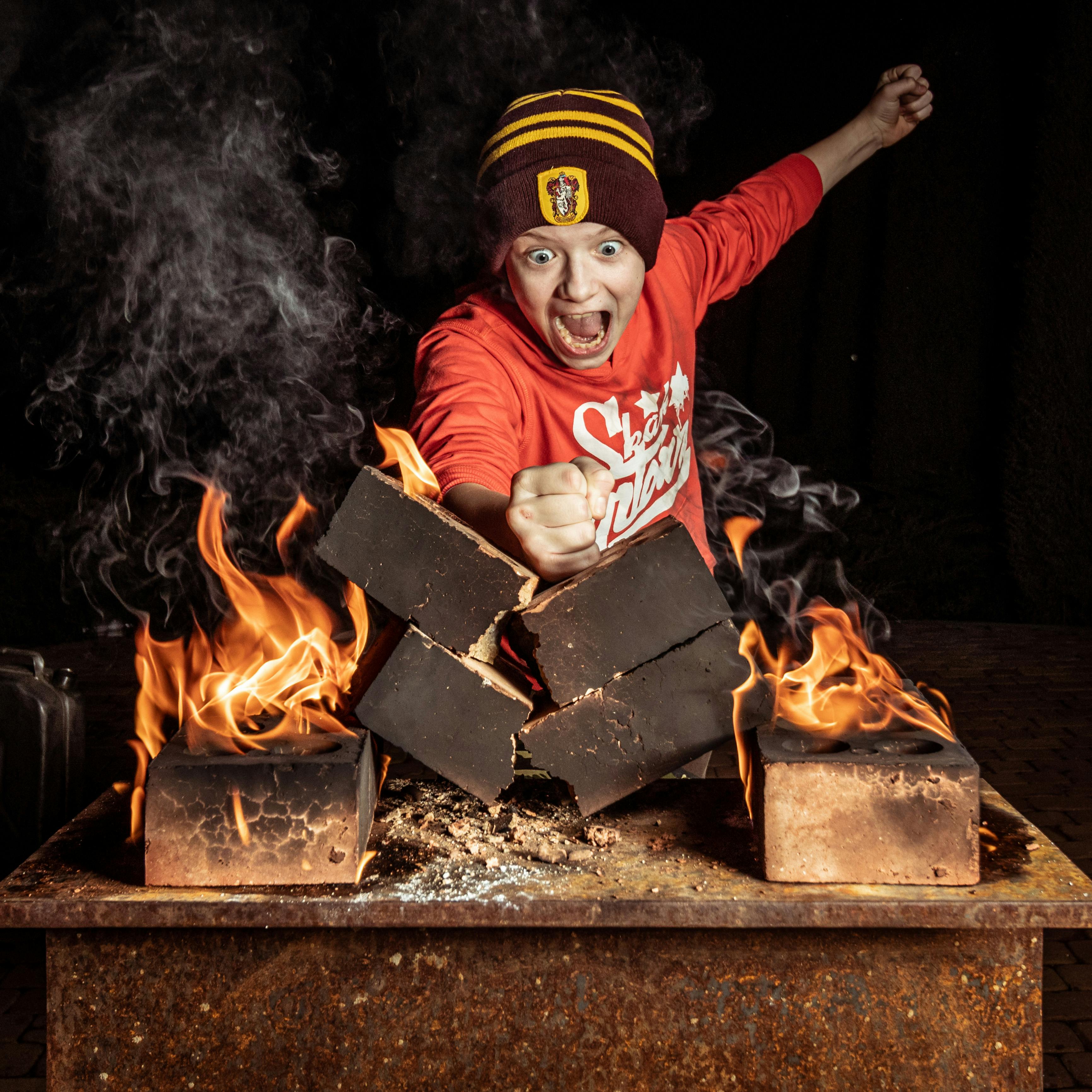 Boy Breaking Bricks on Fire · Free Stock Photo