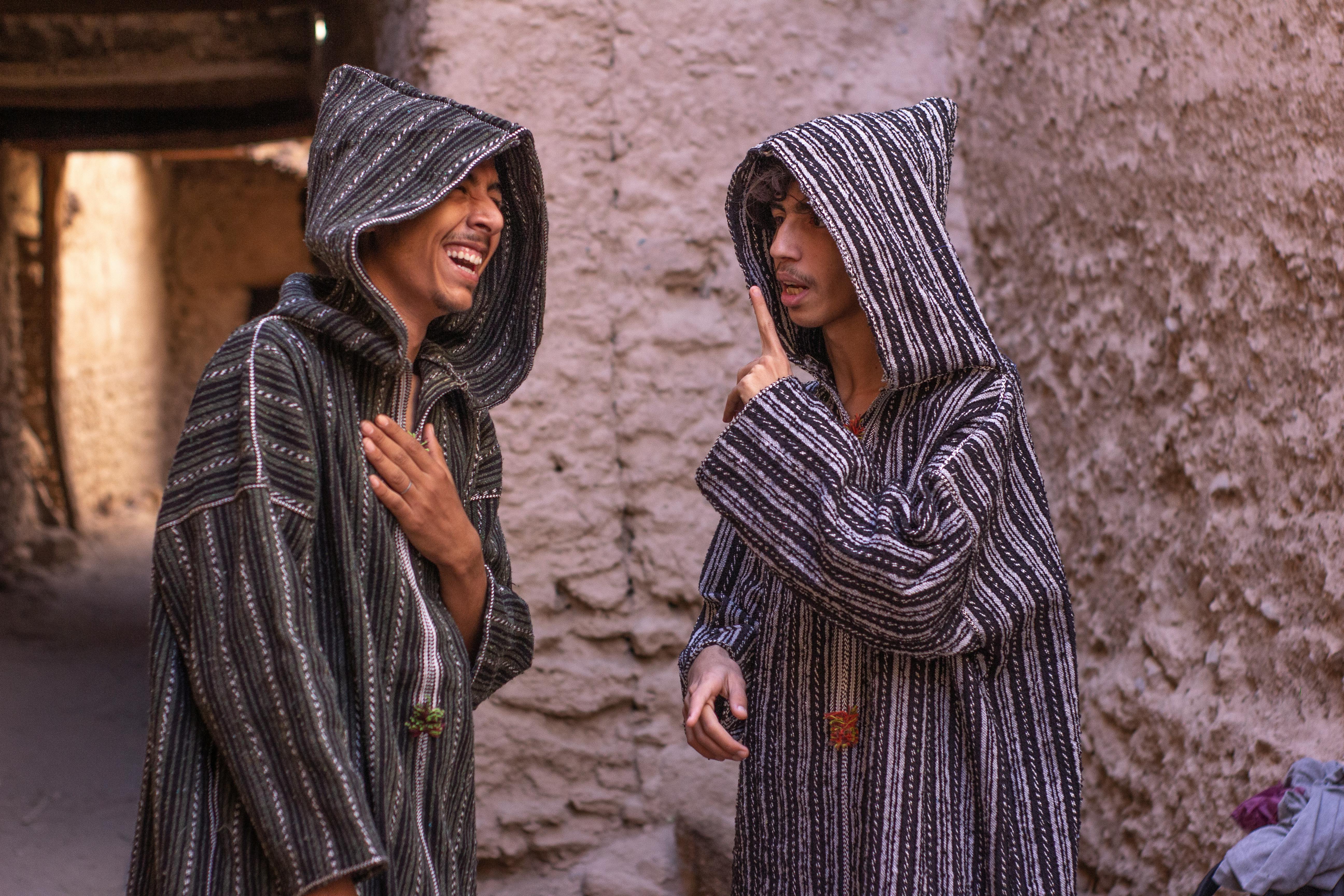 Two Men Standing while Talking · Free Stock Photo