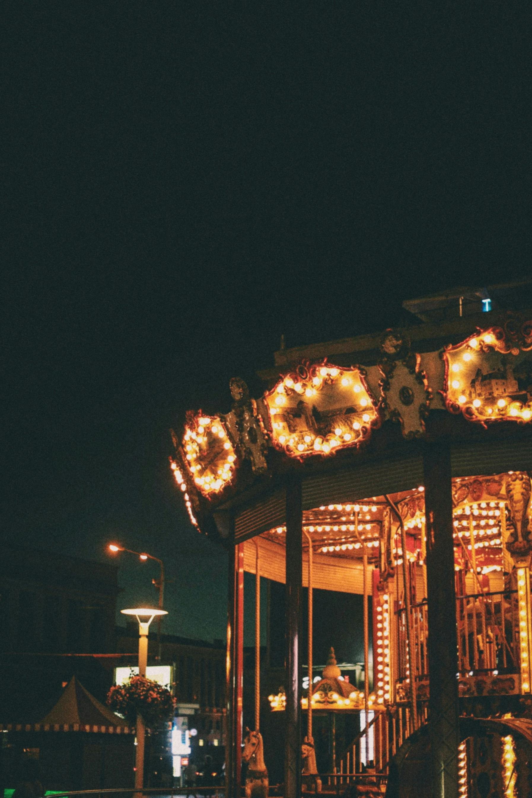 Colorful luminous carousel against Kremlin on Red Square at night ...