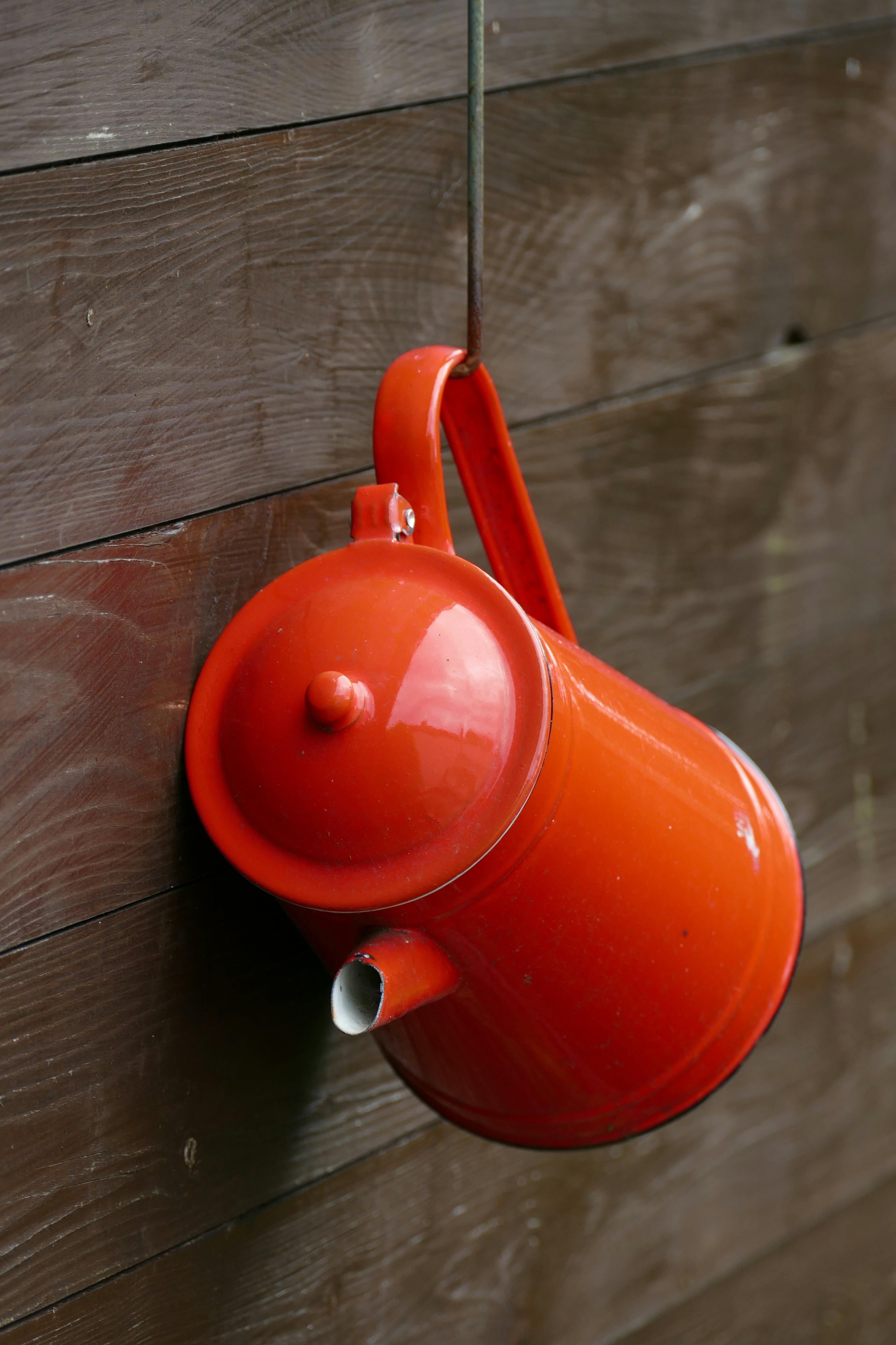 Orange Ceramic Pitcher Hanging · Free Stock Photo