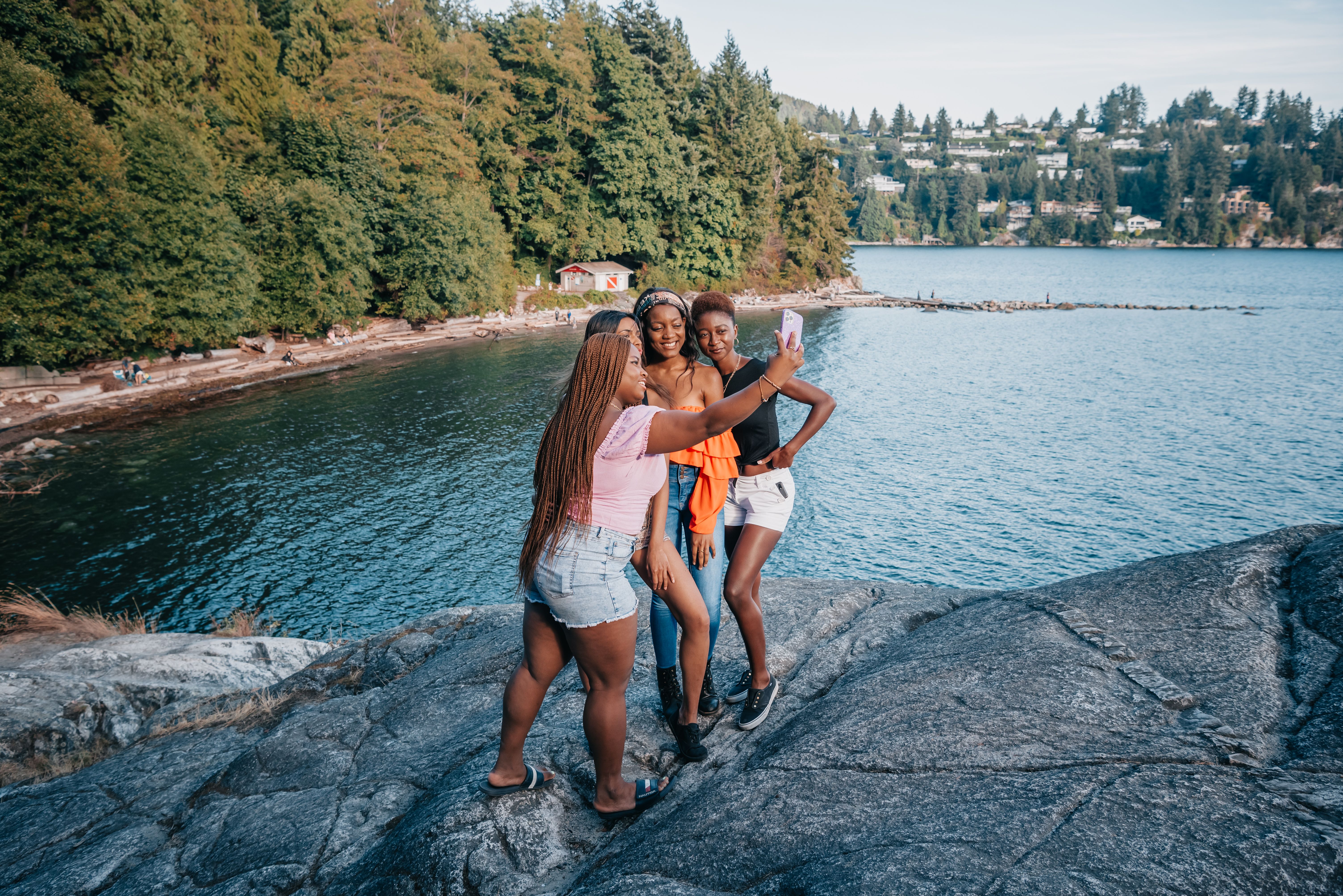 Happy diverse friends taking selfie in park · Free Stock Photo
