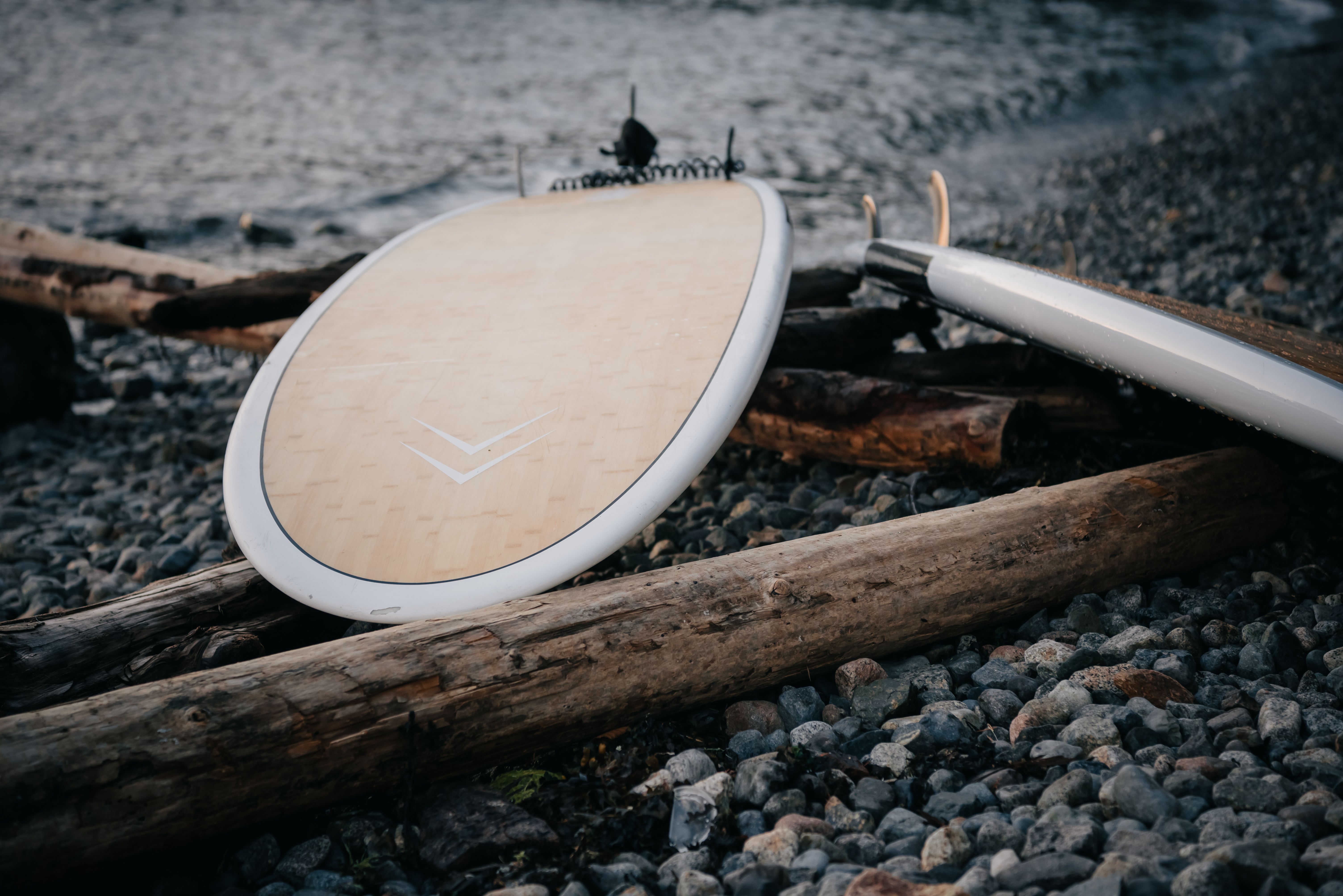 Close Up Photo of Surfboards on Top of Tree Logs · Free Stock Photo