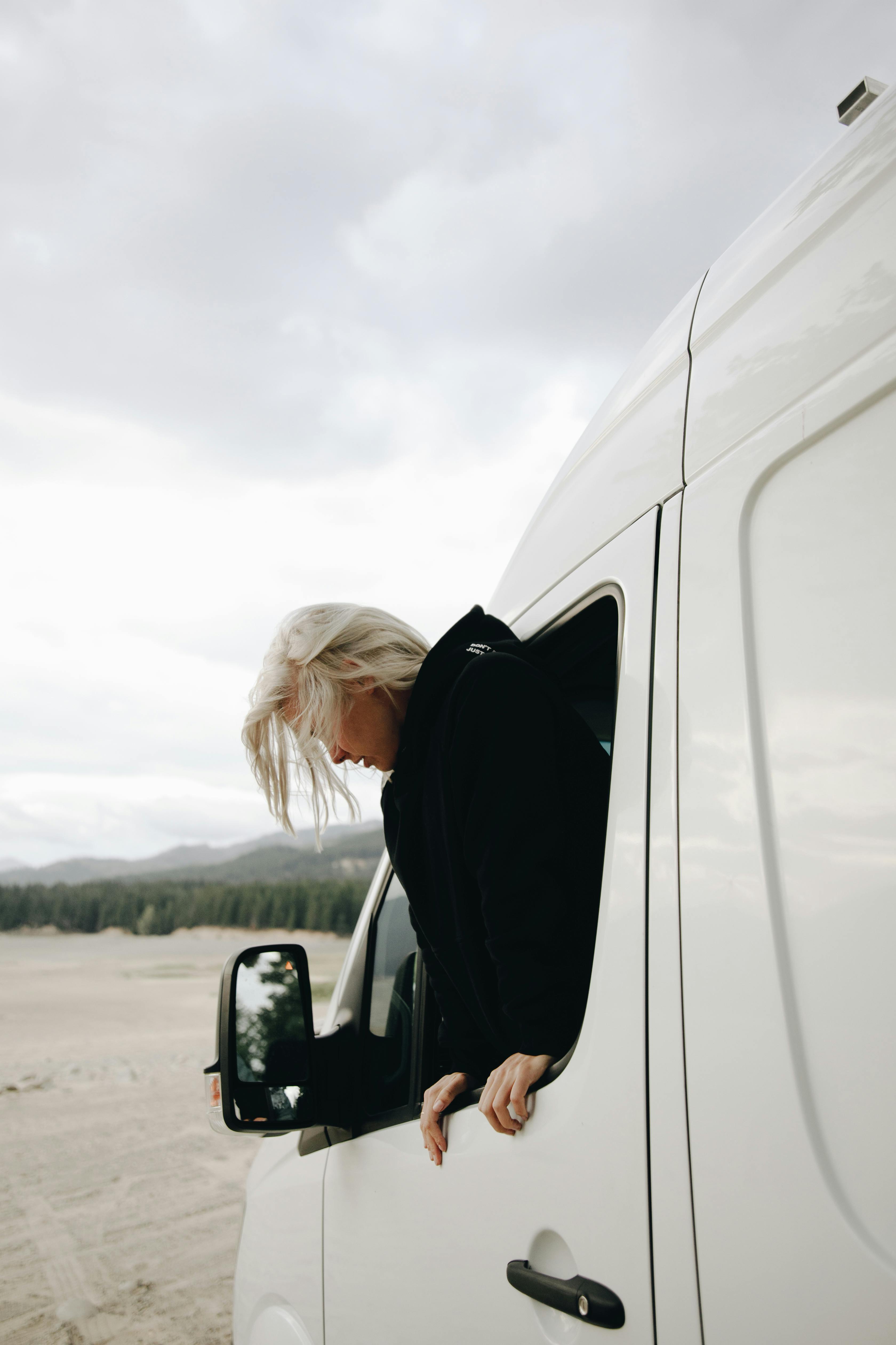Woman Looking out Van Window · Free Stock Photo