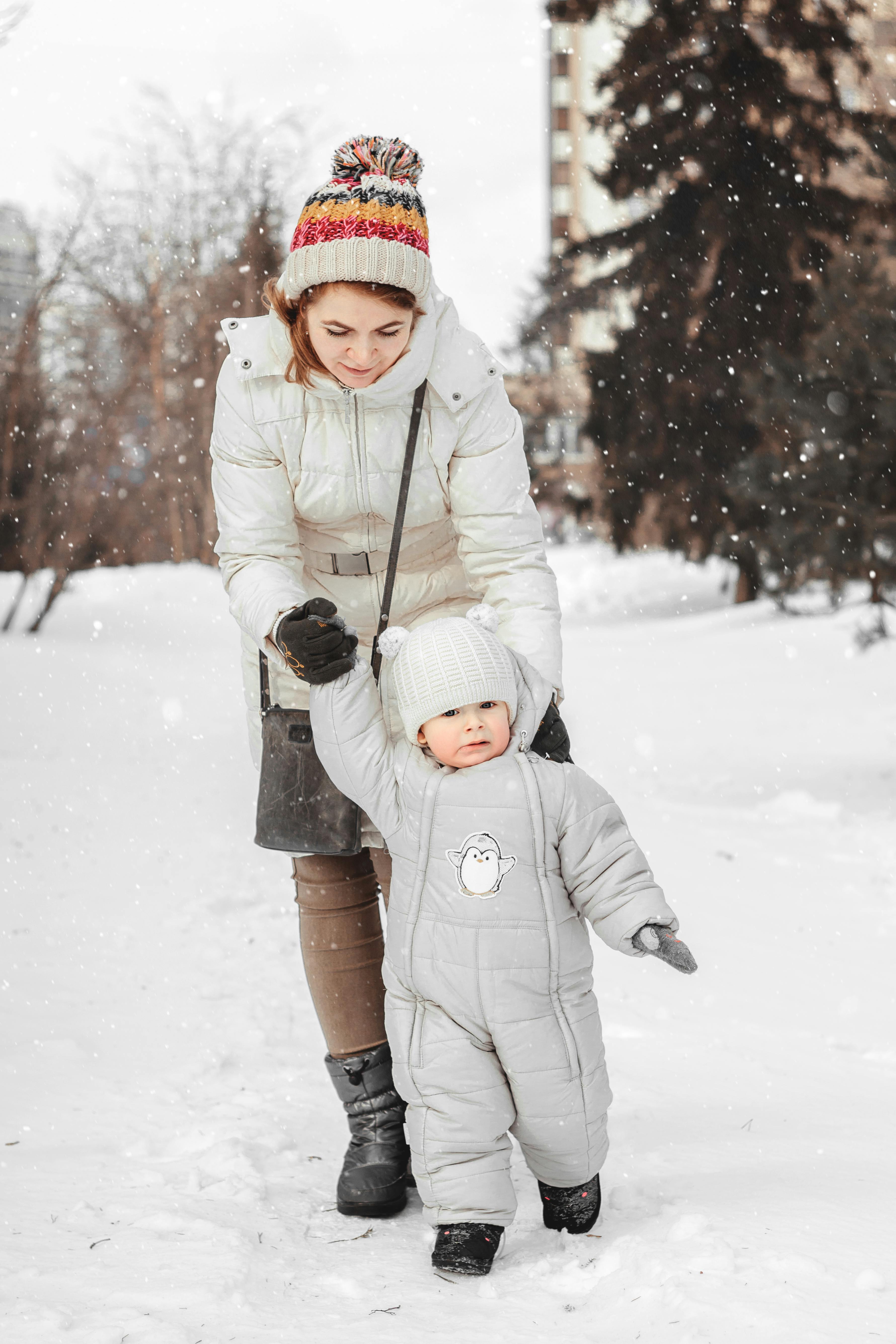 Mother and Child Playing on the Snow · Free Stock Photo