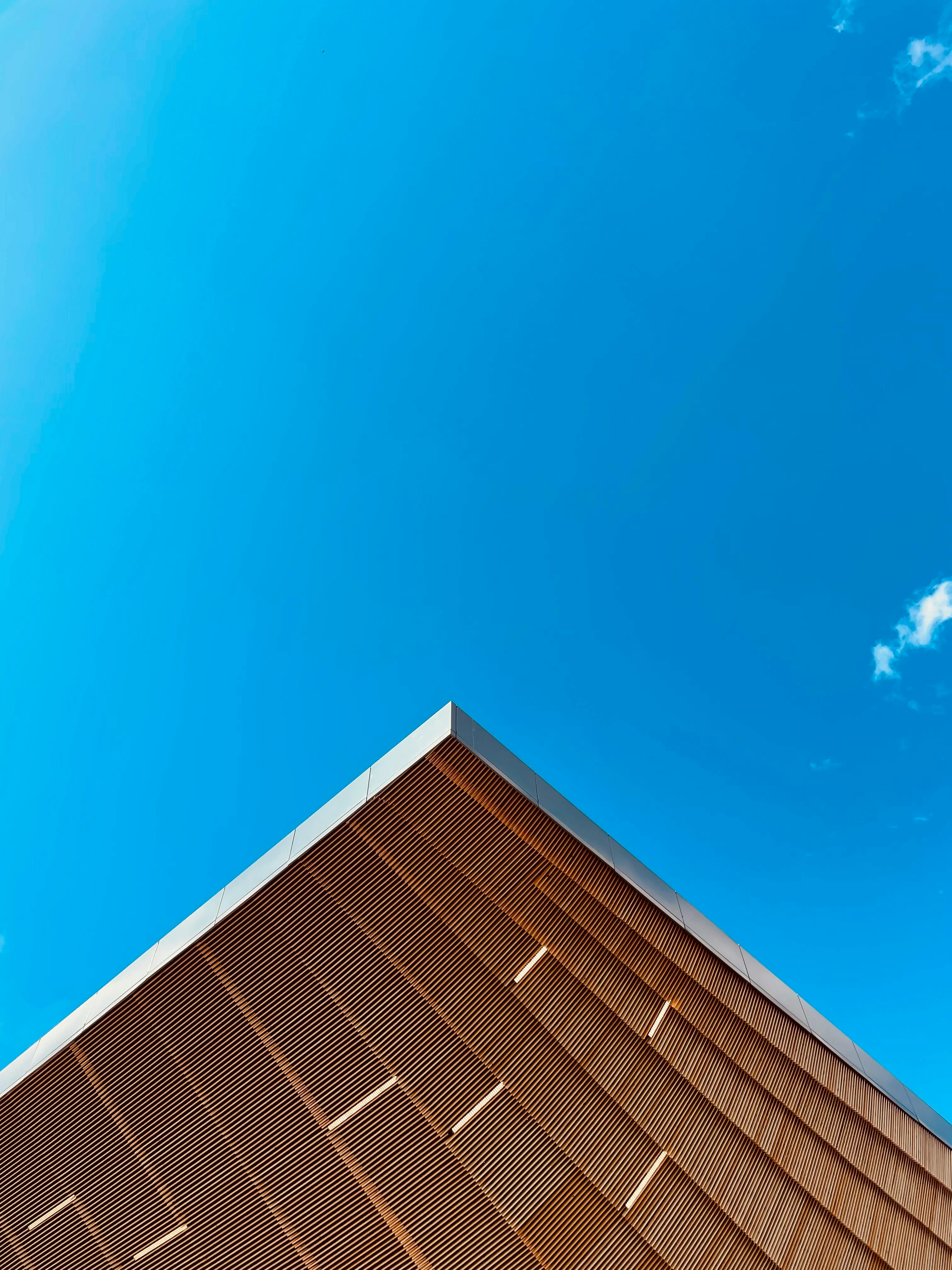 Low Angle Shot of a Corner of a Thatched Roof · Free Stock Photo