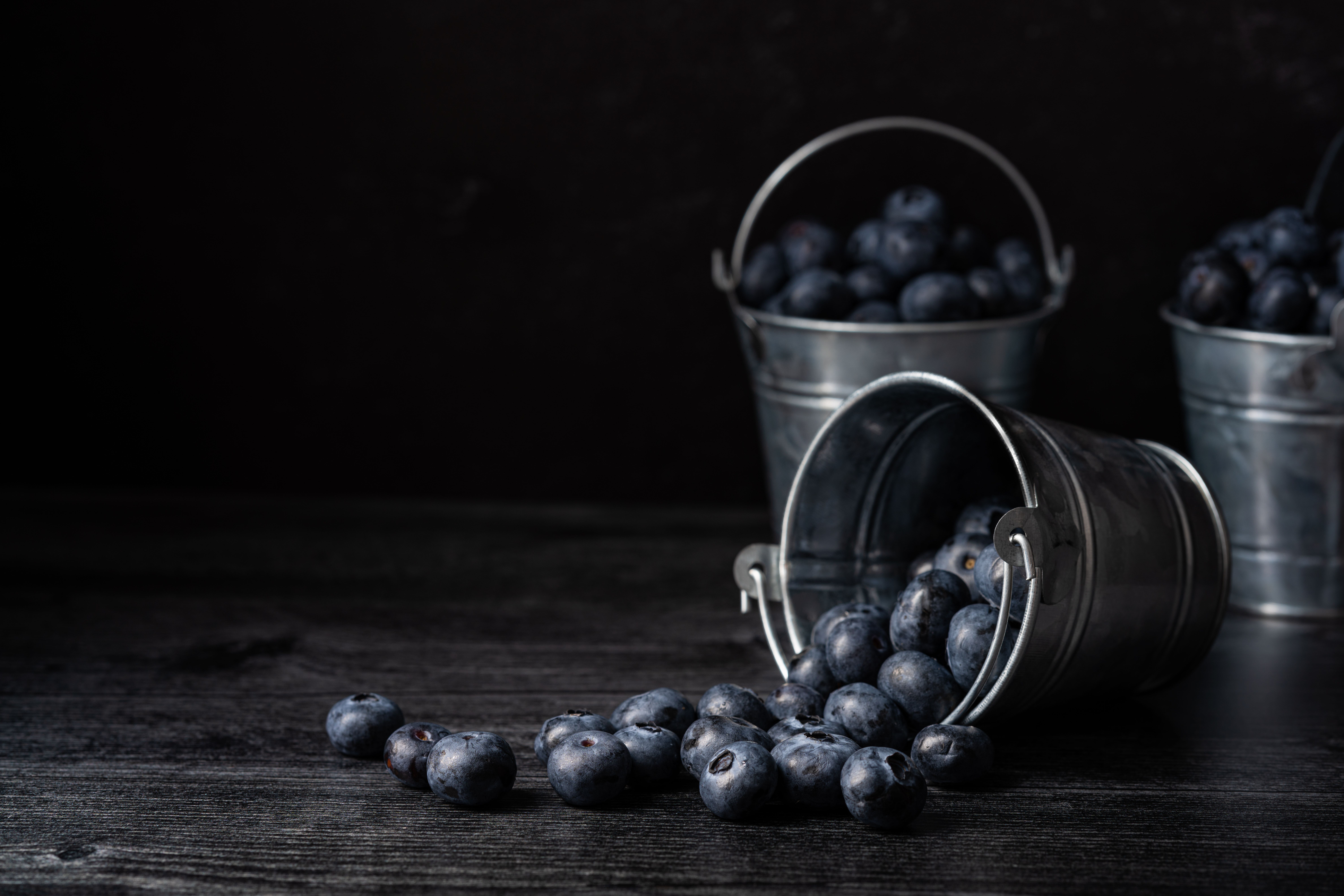 A Close-Up Shot of Buckets of Blueberries · Free Stock Photo