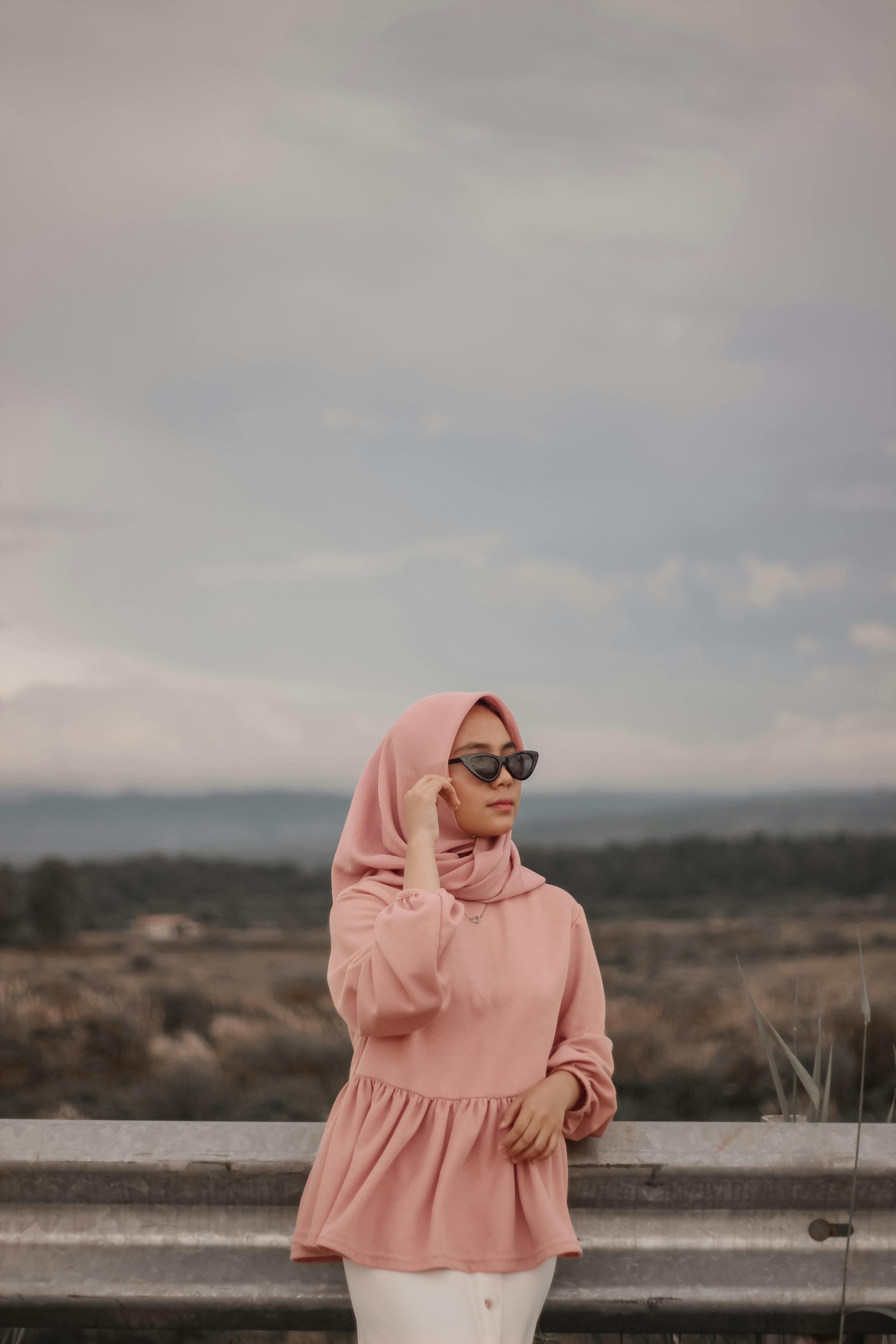 Woman Leaning against Railing · Free Stock Photo