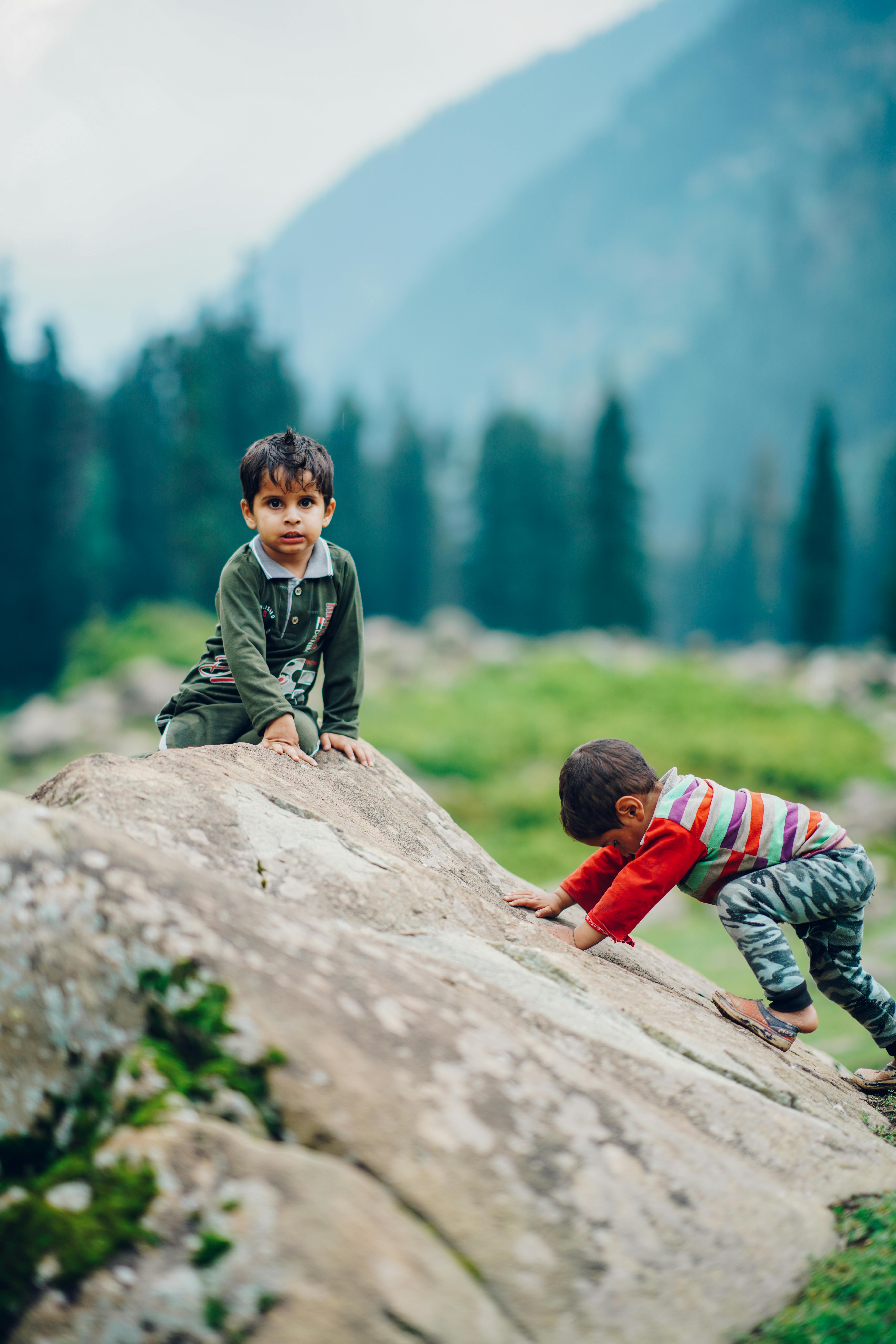 Kids Playing on the Rock · Free Stock Photo