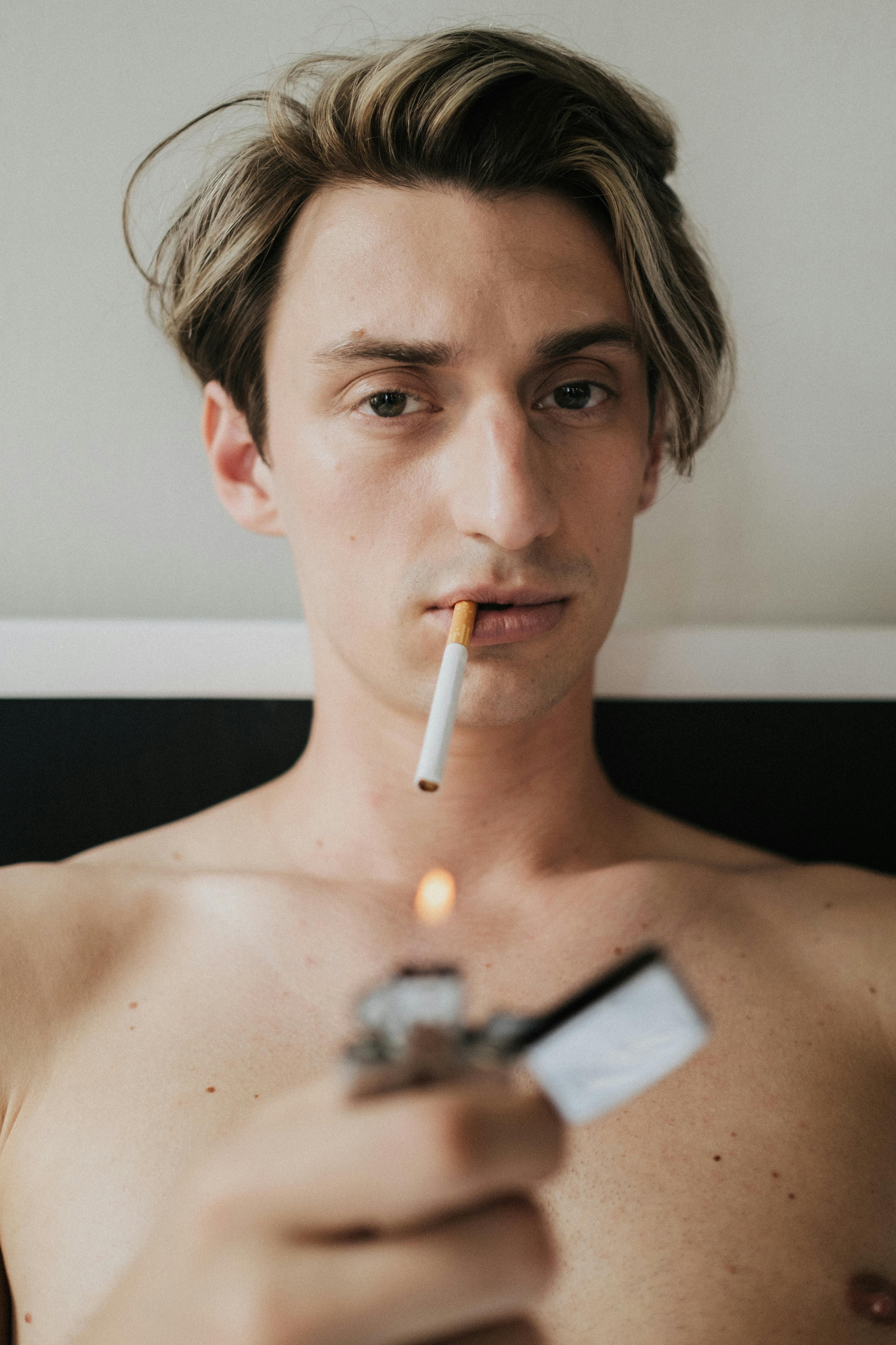 A Man Smoking a Cigarette · Free Stock Photo
