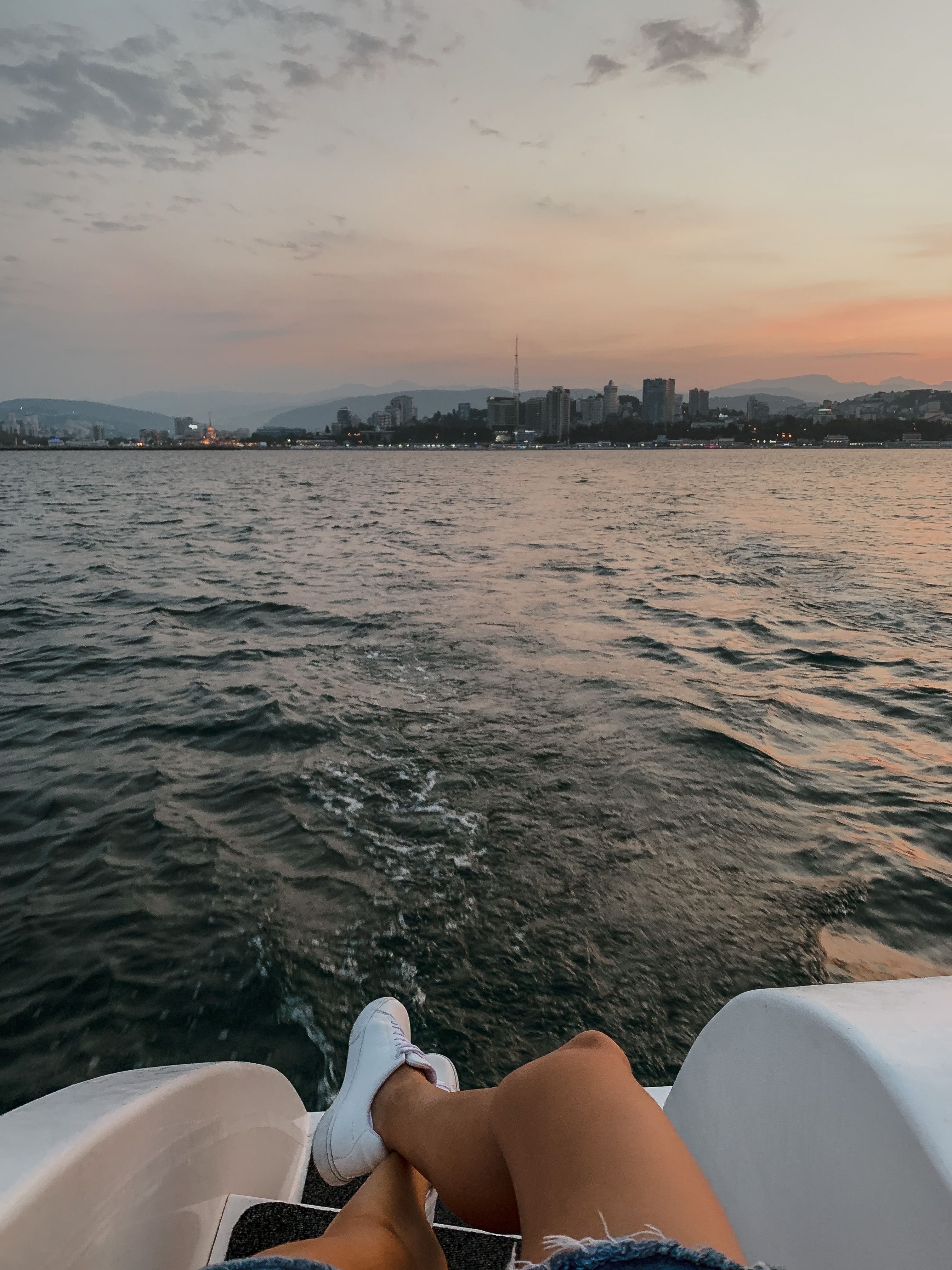Legs of a Woman on a Motorboat at Sea · Free Stock Photo