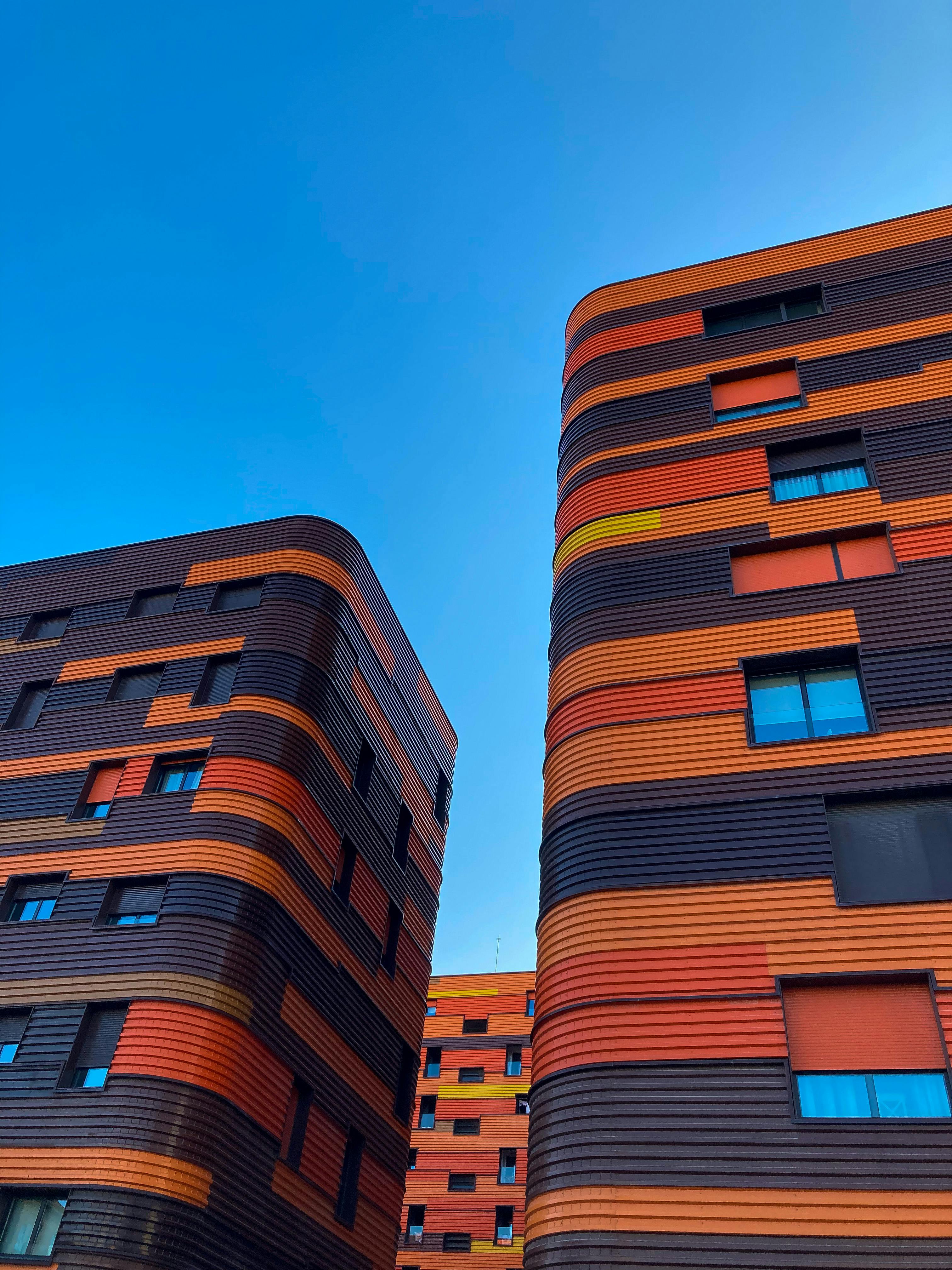 Colorful Apartment Buildings on Blue Sky · Free Stock Photo
