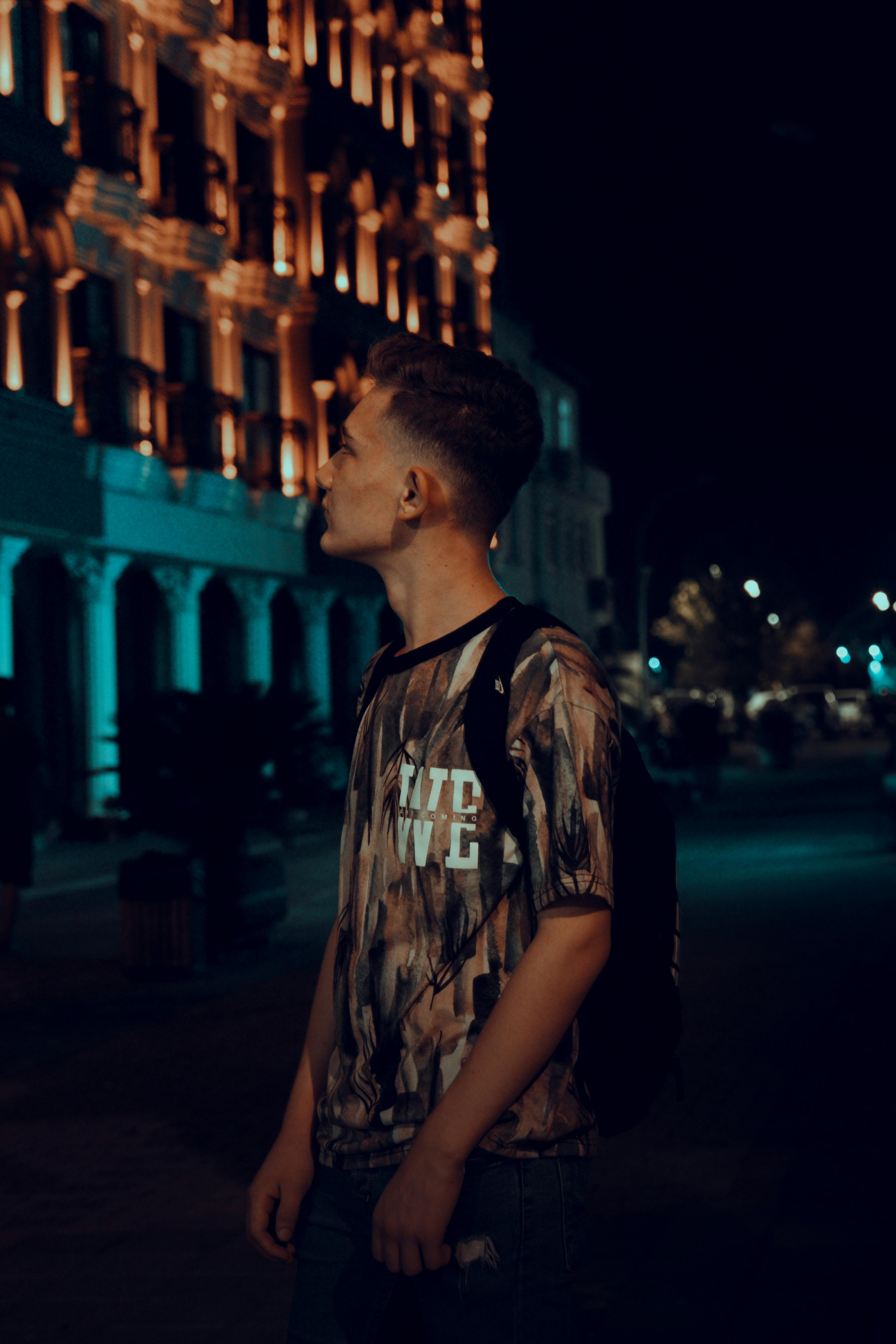 Person Crossing Road During Night Time · Free Stock Photo