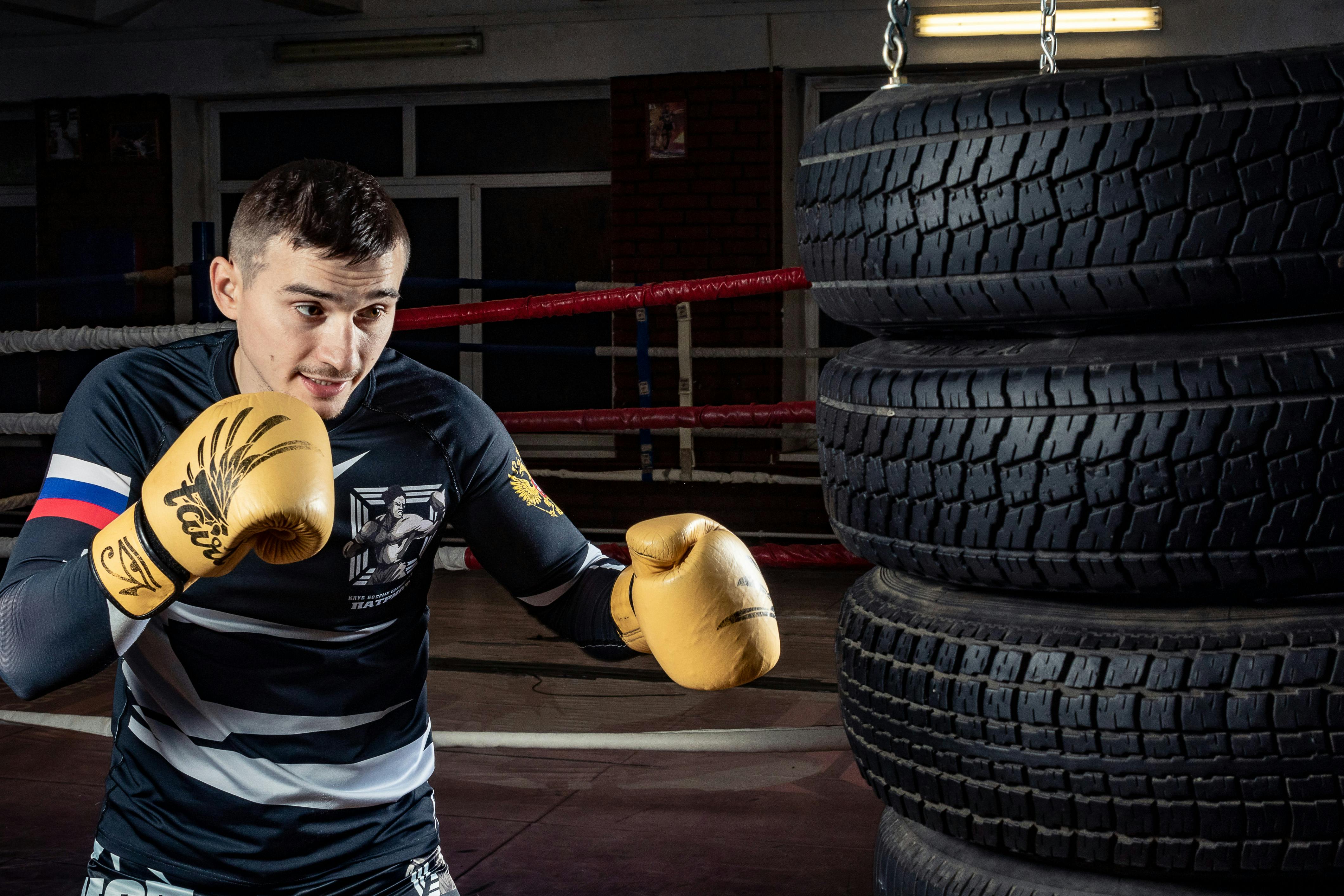Woman Wearing Red Boxing Gloves Sweating on the Gym · Free Stock Photo
