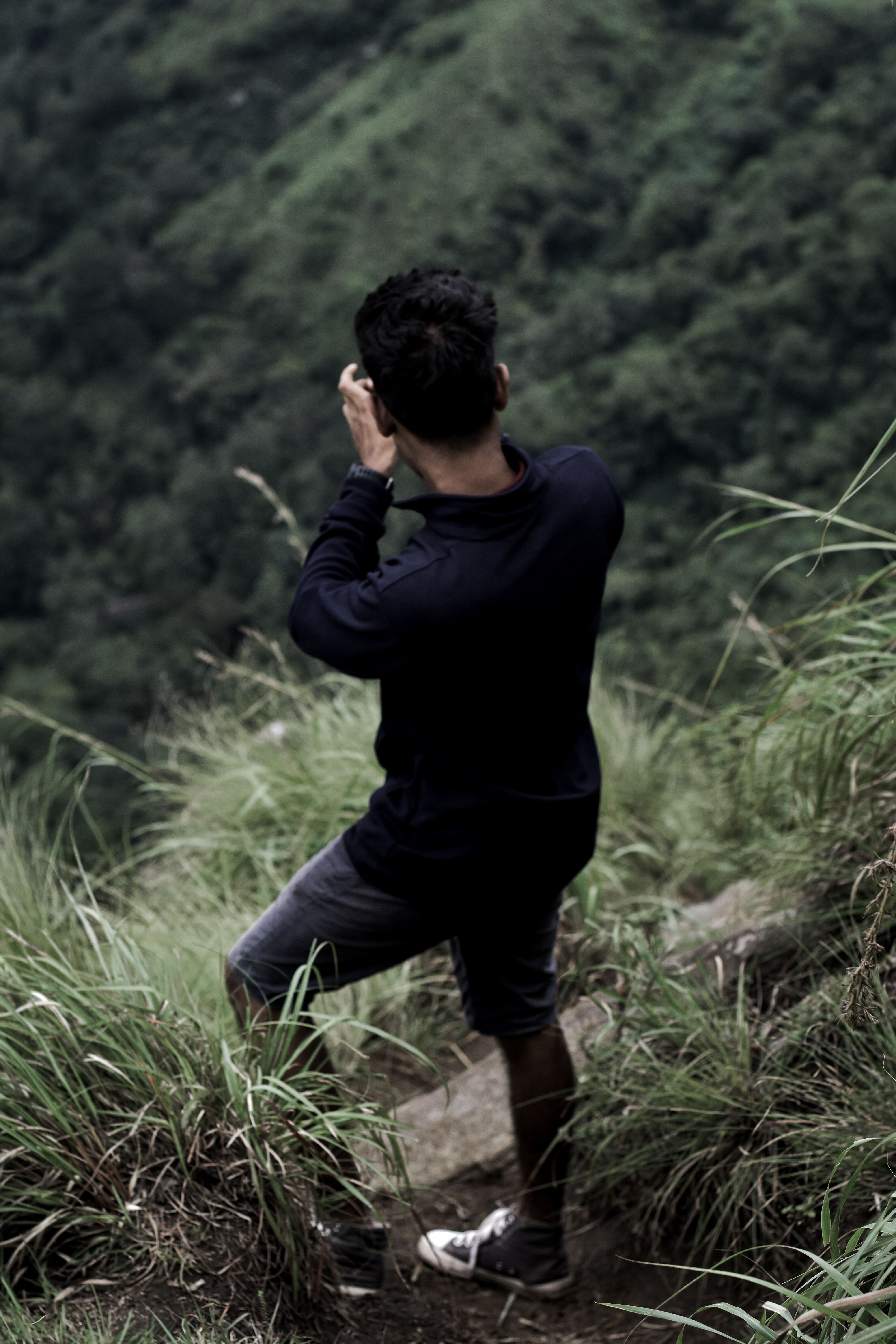 Man Sitting and Looking at a Landscape · Free Stock Photo