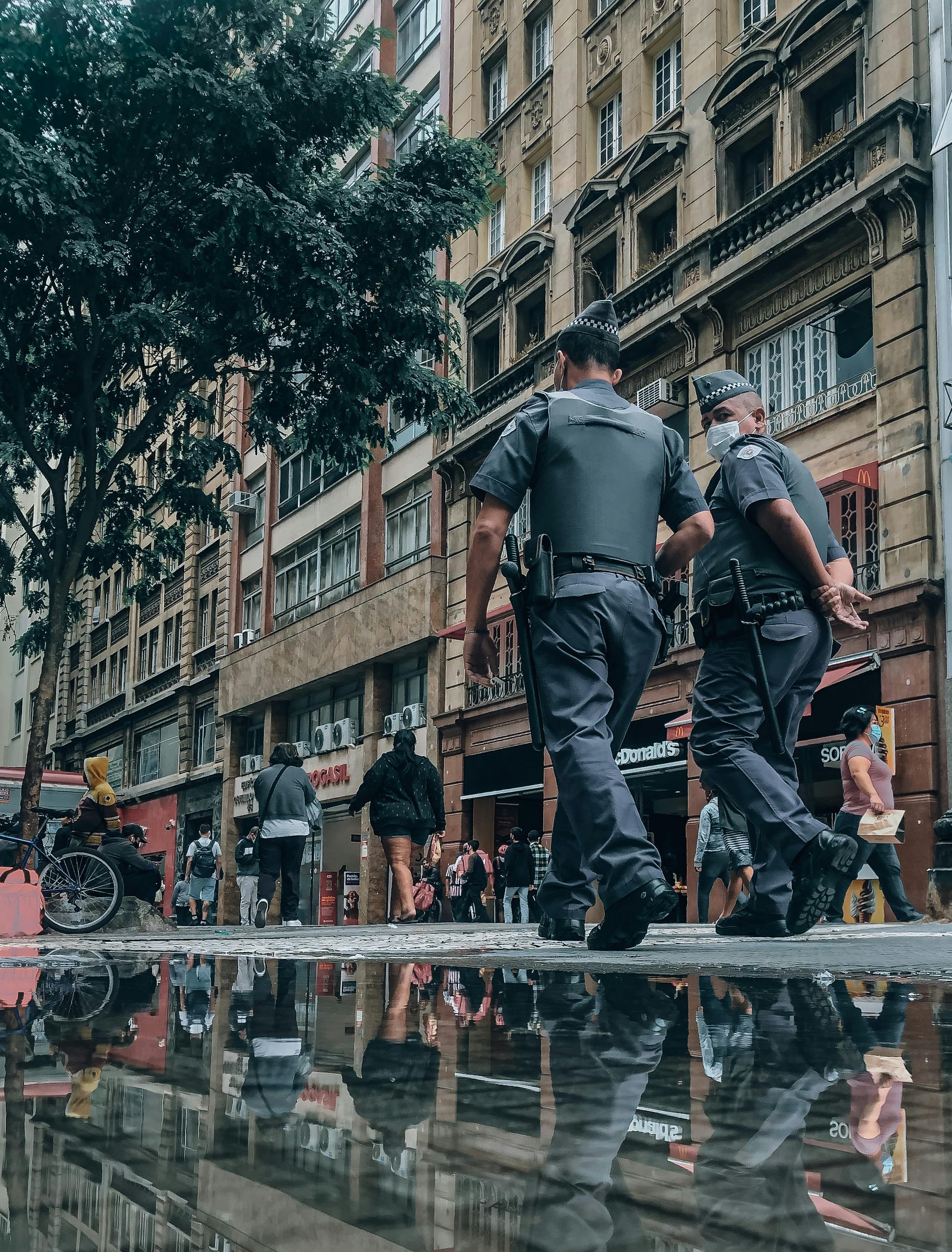 Police Officers Walking on Street · Free Stock Photo